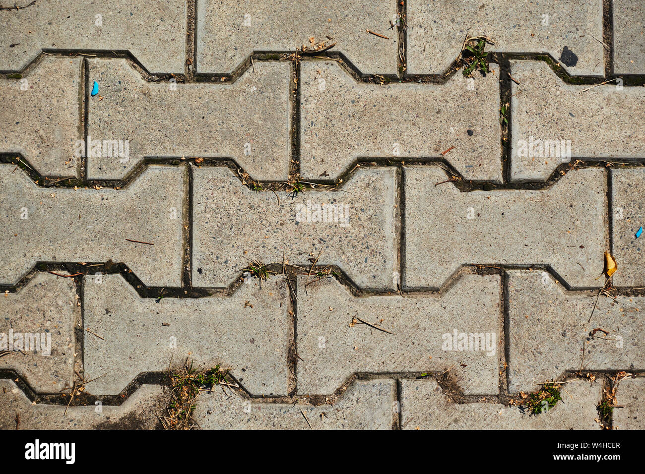 Old cobblestone background with grass. The view from the top Stock ...