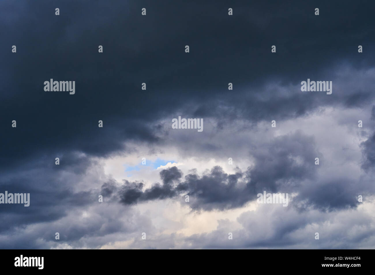 Rain clouds in the cloudy sky covered the sun Stock Photo - Alamy