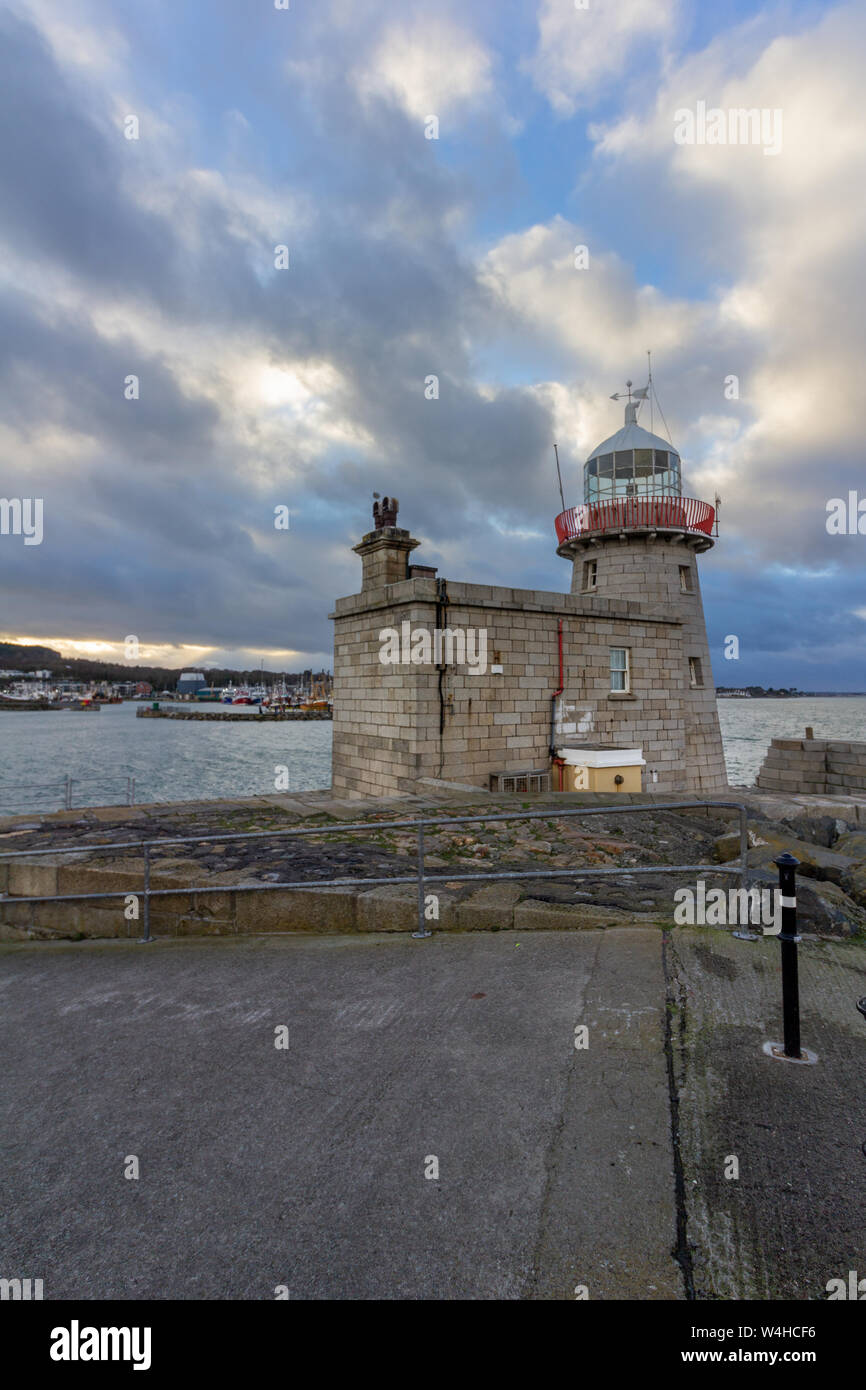 Howth Lighthouse is located at the entrance to the harbor in Howth ...
