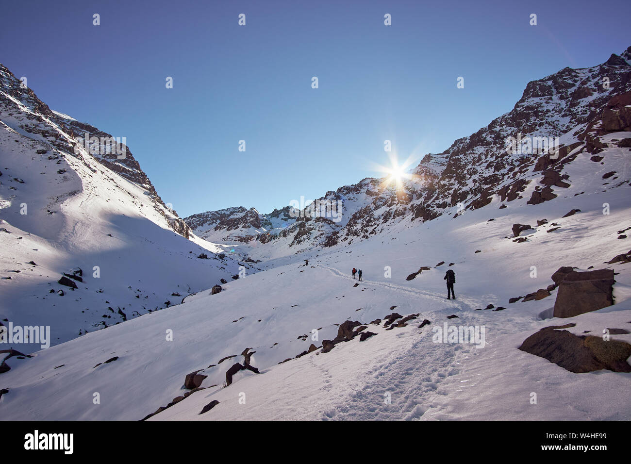 Tourist path through the snow fields in high altitude of Atlas ...