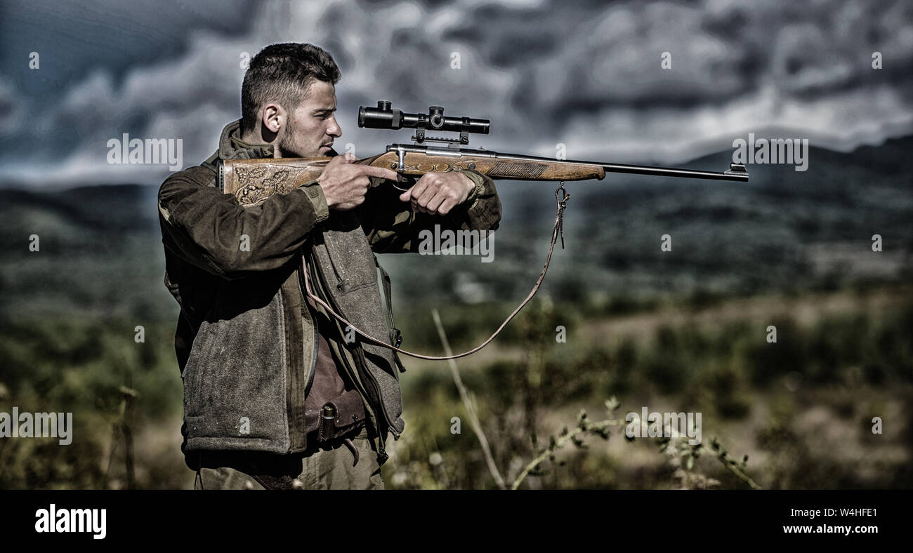 Guy hunting nature environment. Hunting weapon gun or rifle. Masculine ...