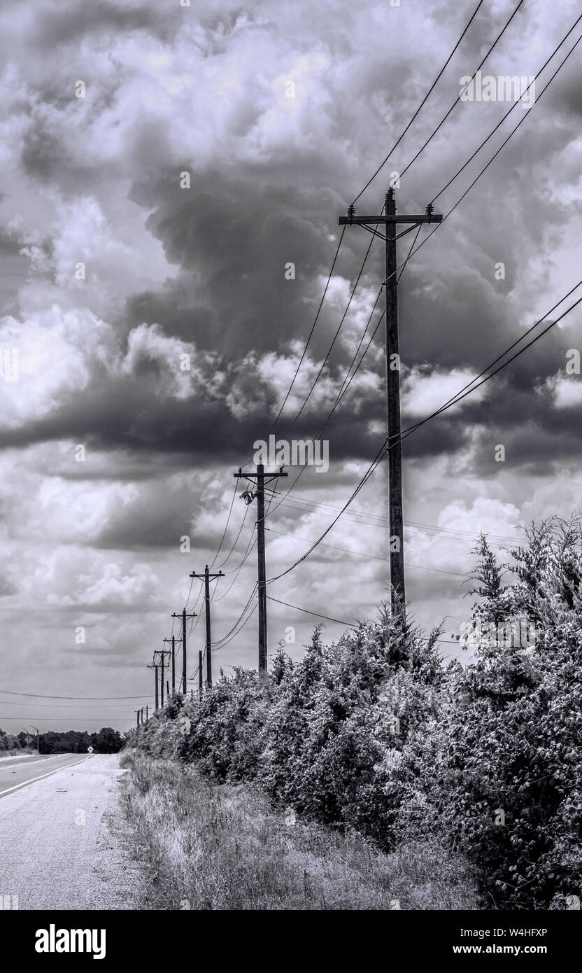 Electrical power poles and wires along rural Texas highway under ...