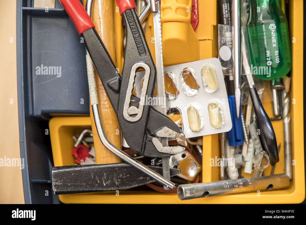 Symbol picture drug addiction, tablets, at work, craftsman, tool box ...