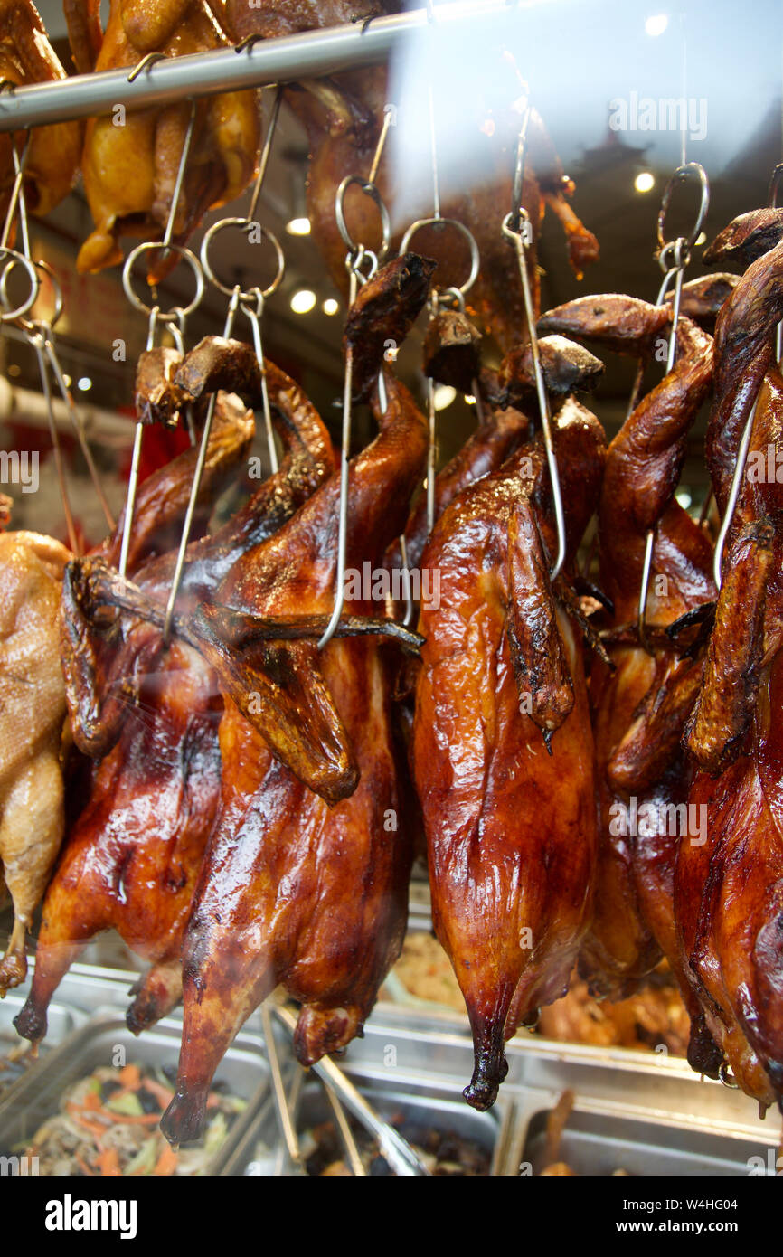 Roasted ducks hanging in window hi-res stock photography and images - Alamy