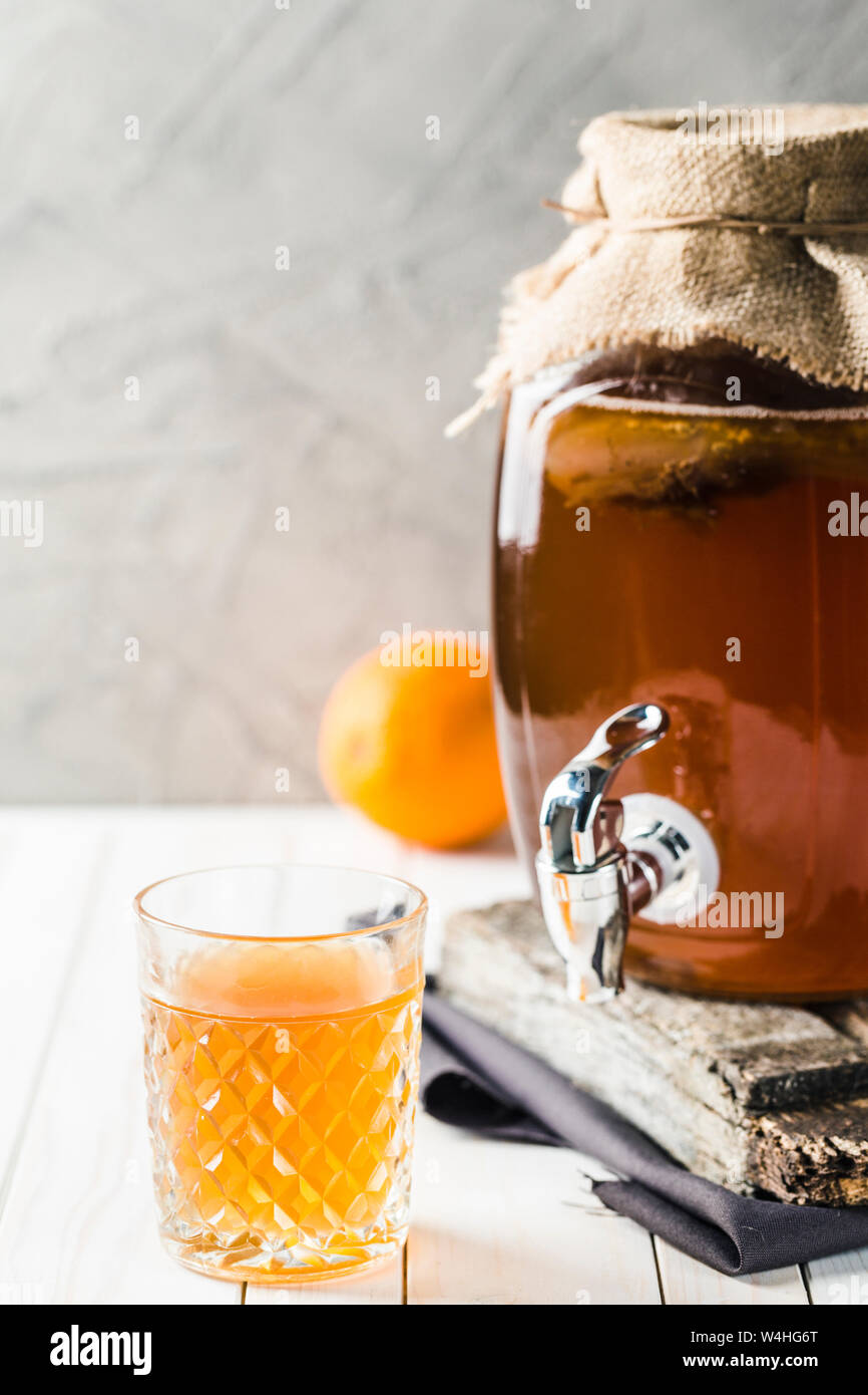 Kombucha tea drink with beneficial bacteria on wooden white background ... Kombucha tea drink with beneficial bacteria on wooden white background ...