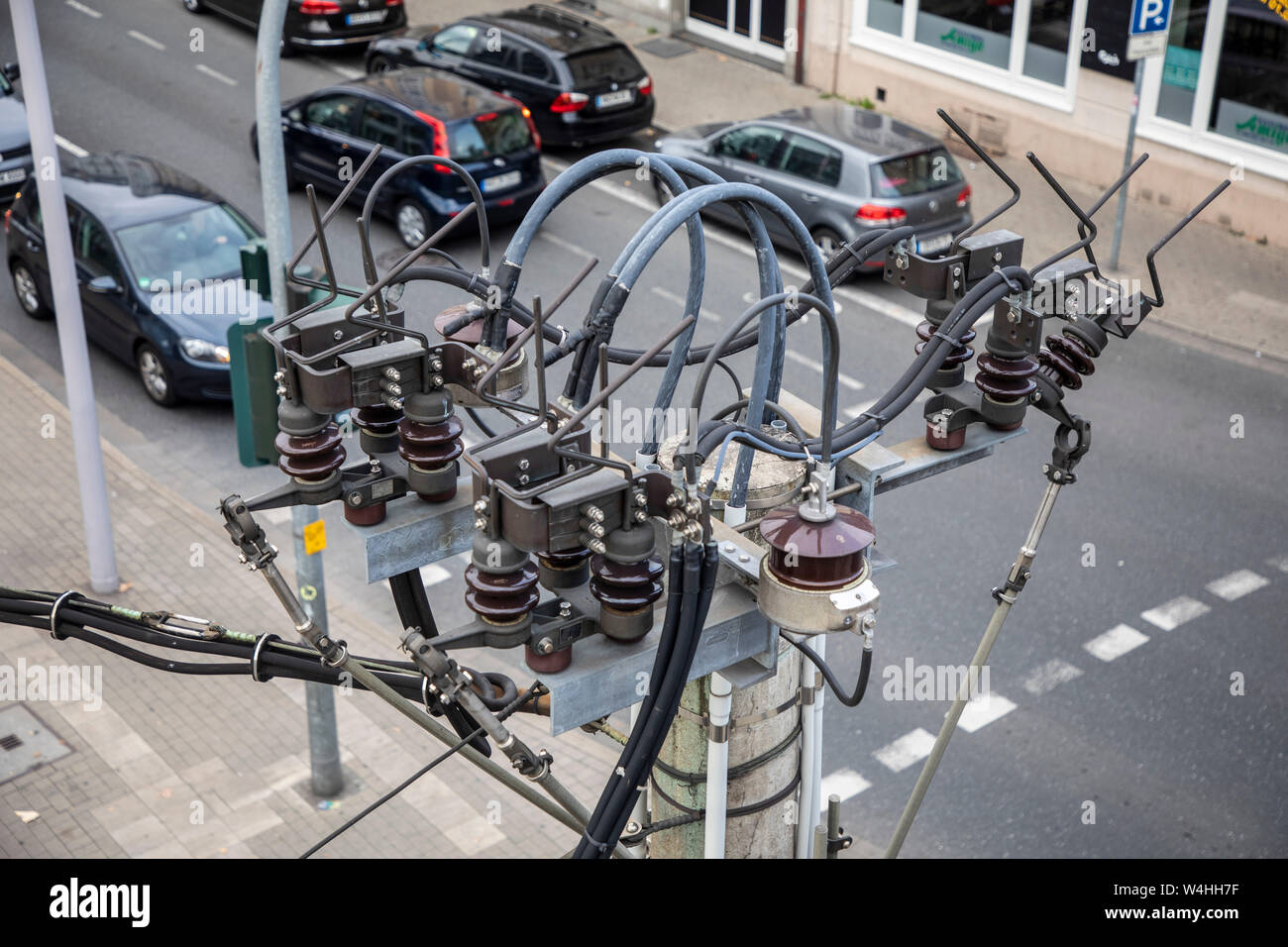 Mast of an overhead line for a tram line, power supply, cables ...