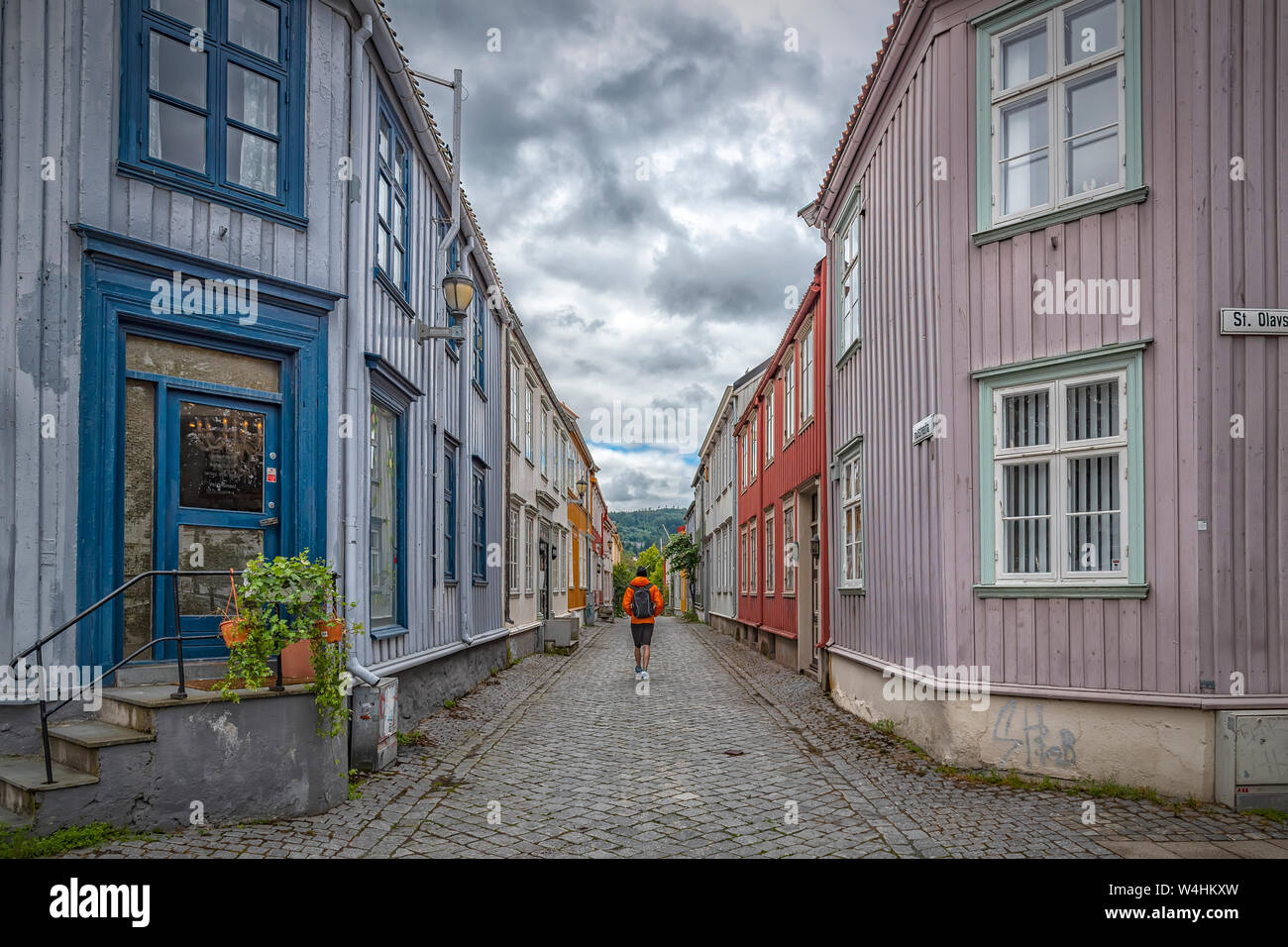 A backpacker walks down one of the many picturesque streets in the ...