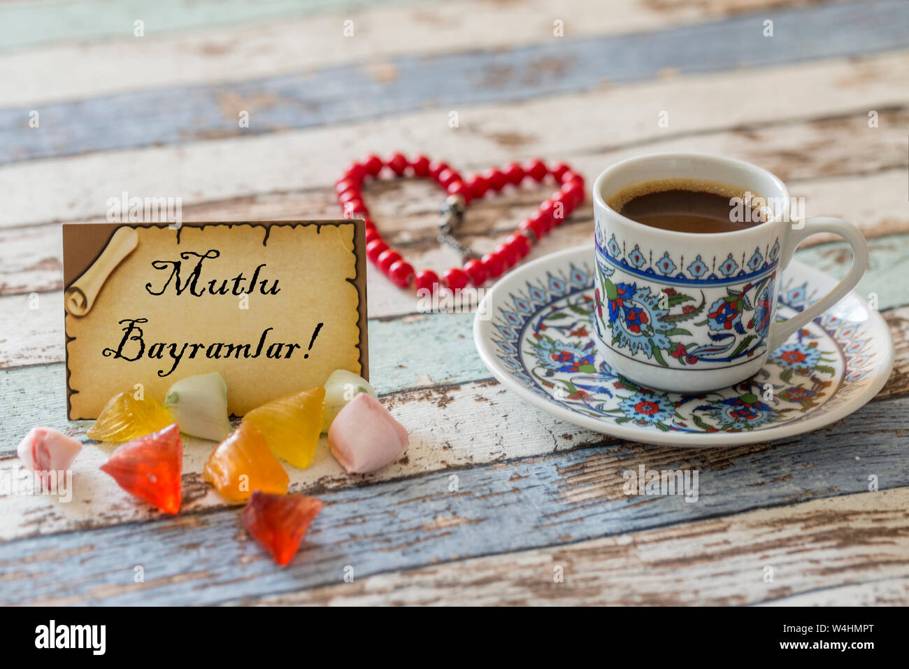 Greeting card writing "Happy Eid" in Turkish with sugar candies ...