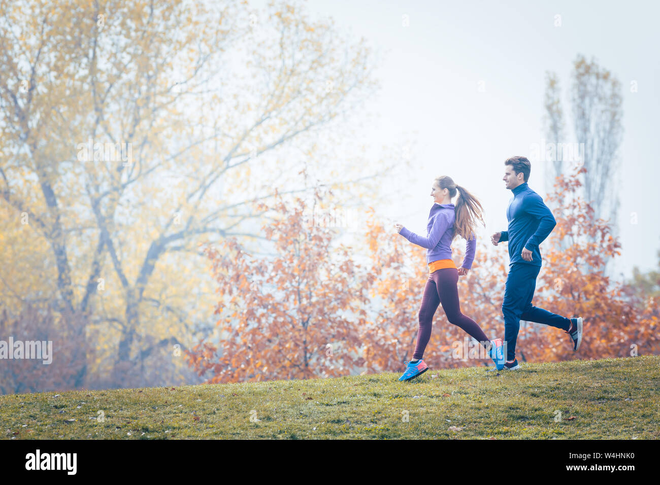 Attractive man jogging in park hi-res stock photography and images - Alamy