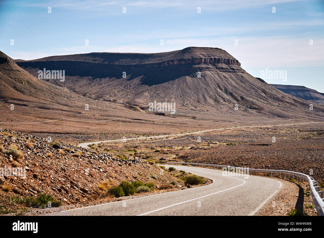 Curved road through rocky desert valley in Morocco Africa Stock Photo ...