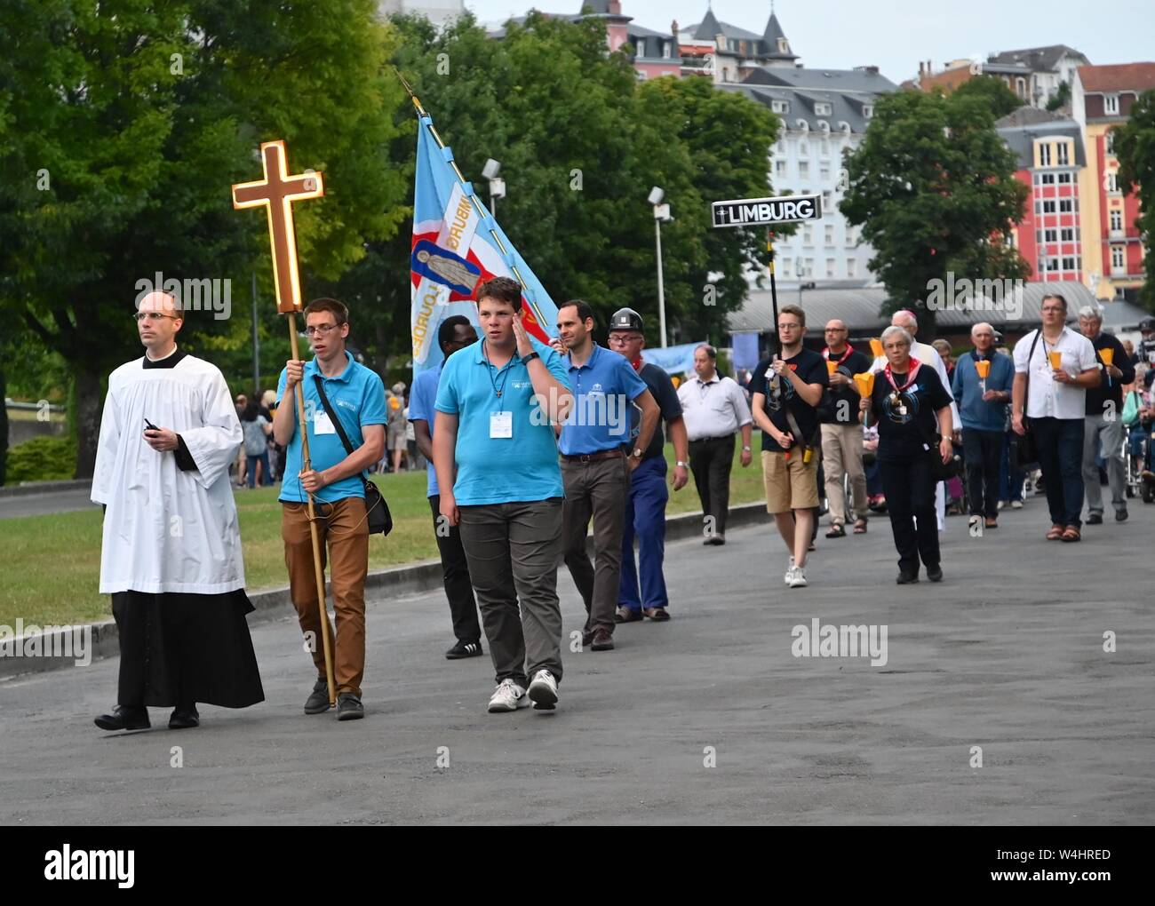 Pilgrims in the Marian procession in Lourdes, France Stock Photo - Alamy
