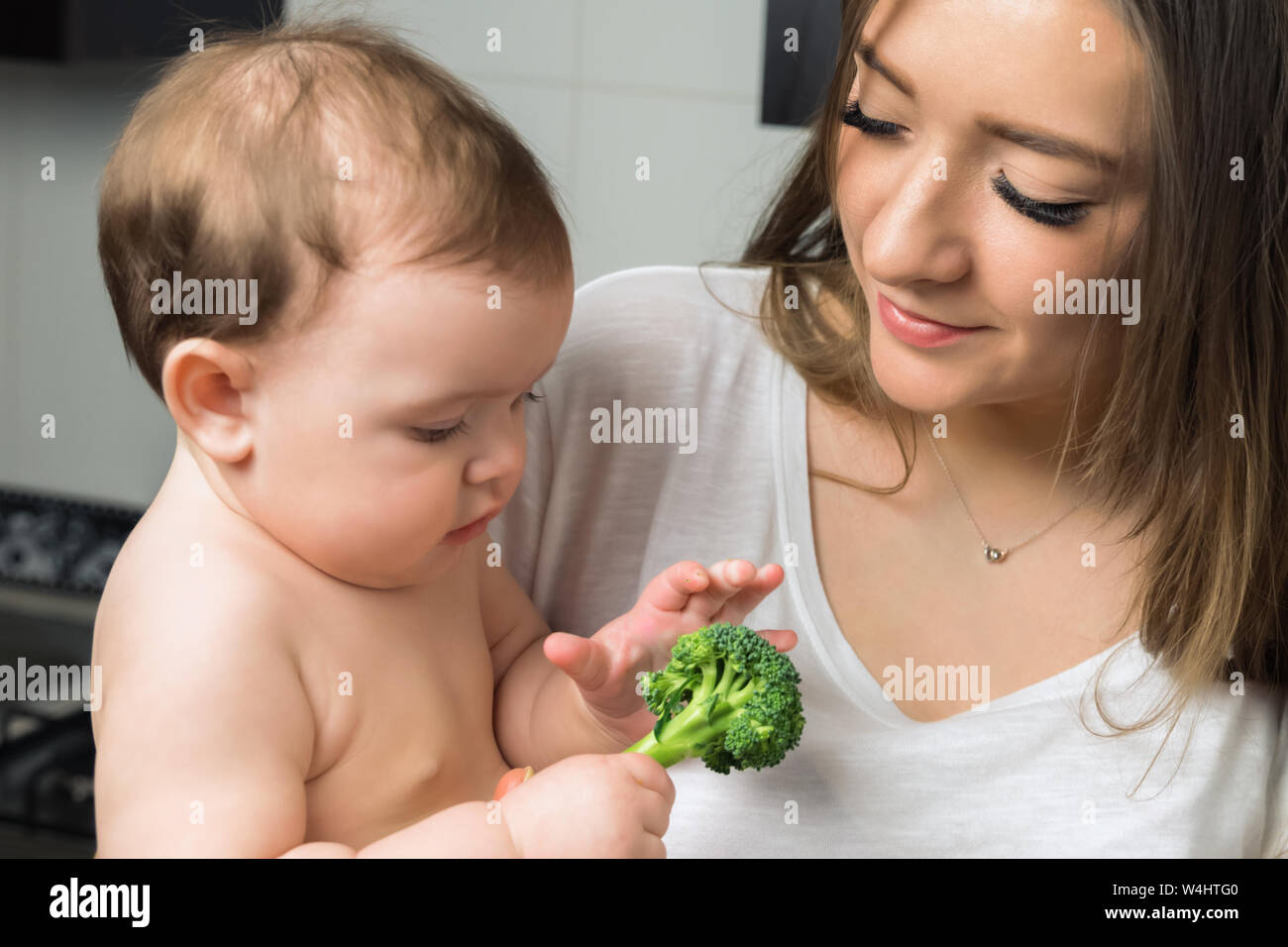 Adorable baby eating broccoli hi-res stock photography and images - Alamy