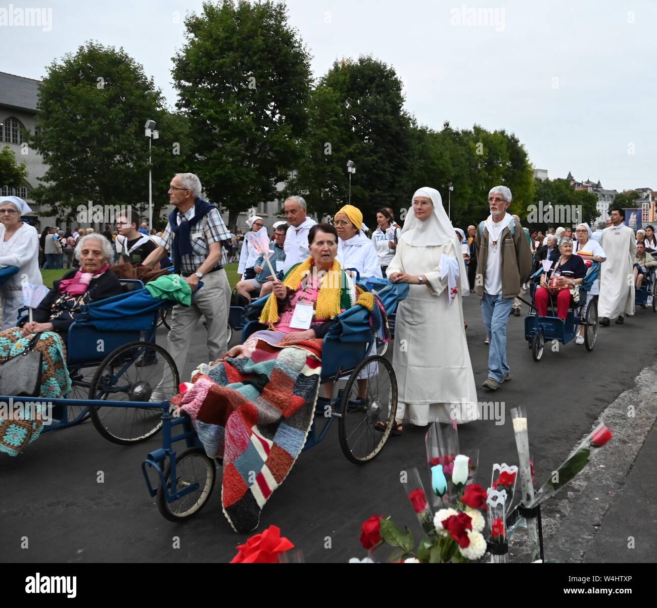 Pilgrims in the Marian procession in Lourdes, France Stock Photo - Alamy