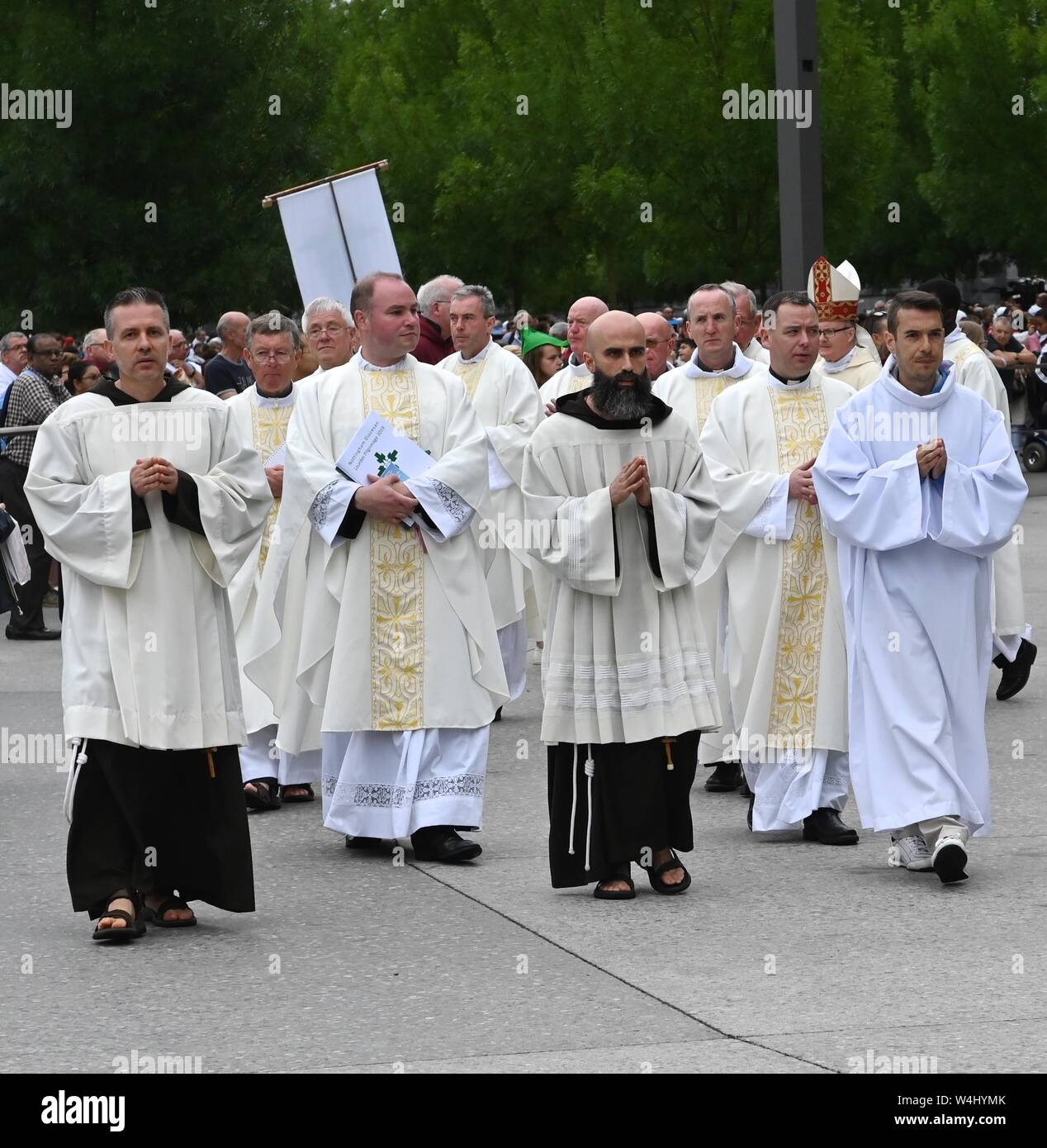 Priests from the Nottingham Diocese leave the grotto after Mass.in ...
