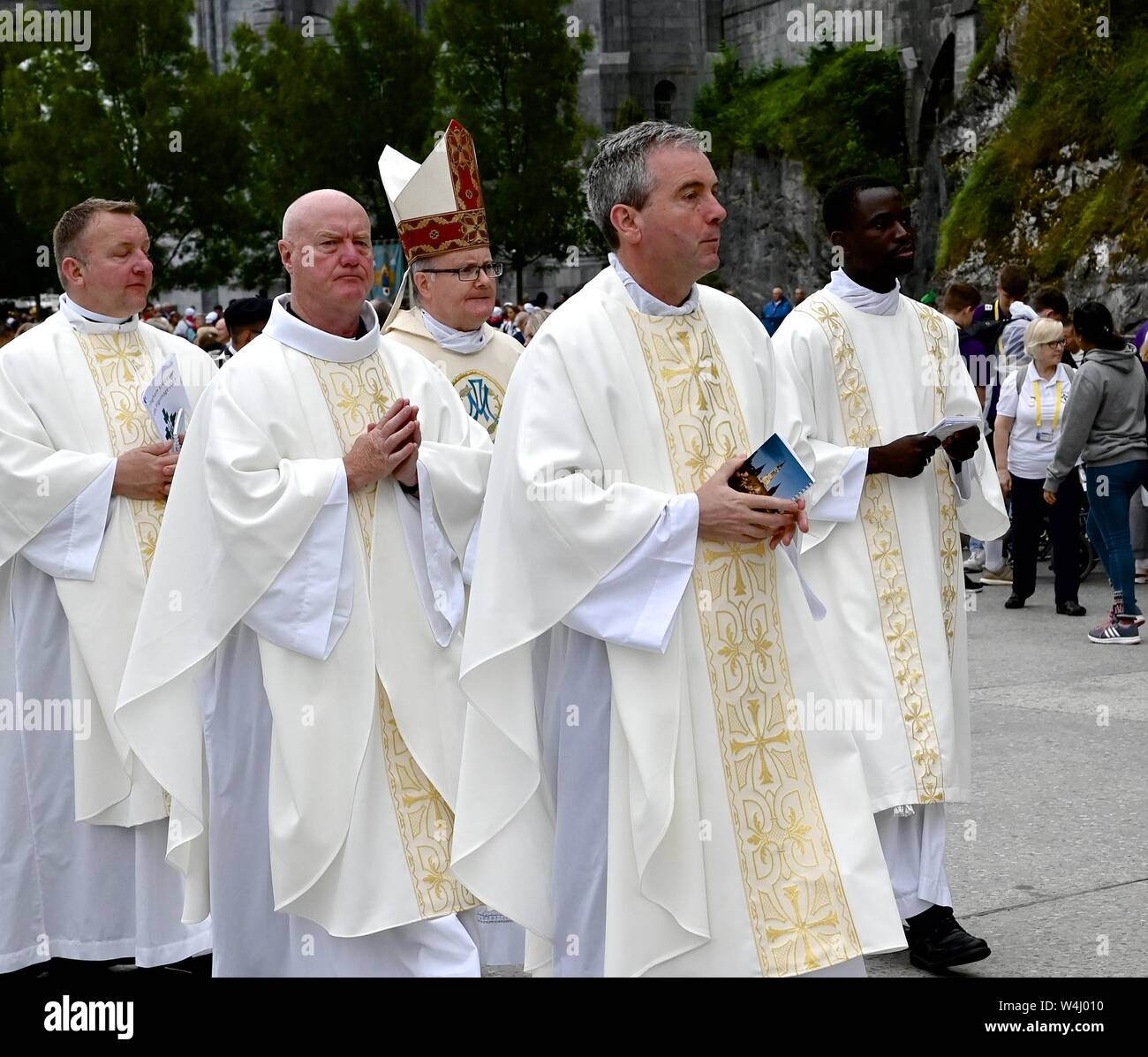 Priests from the Nottingham Diocese leave the grotto after Mass.in ...