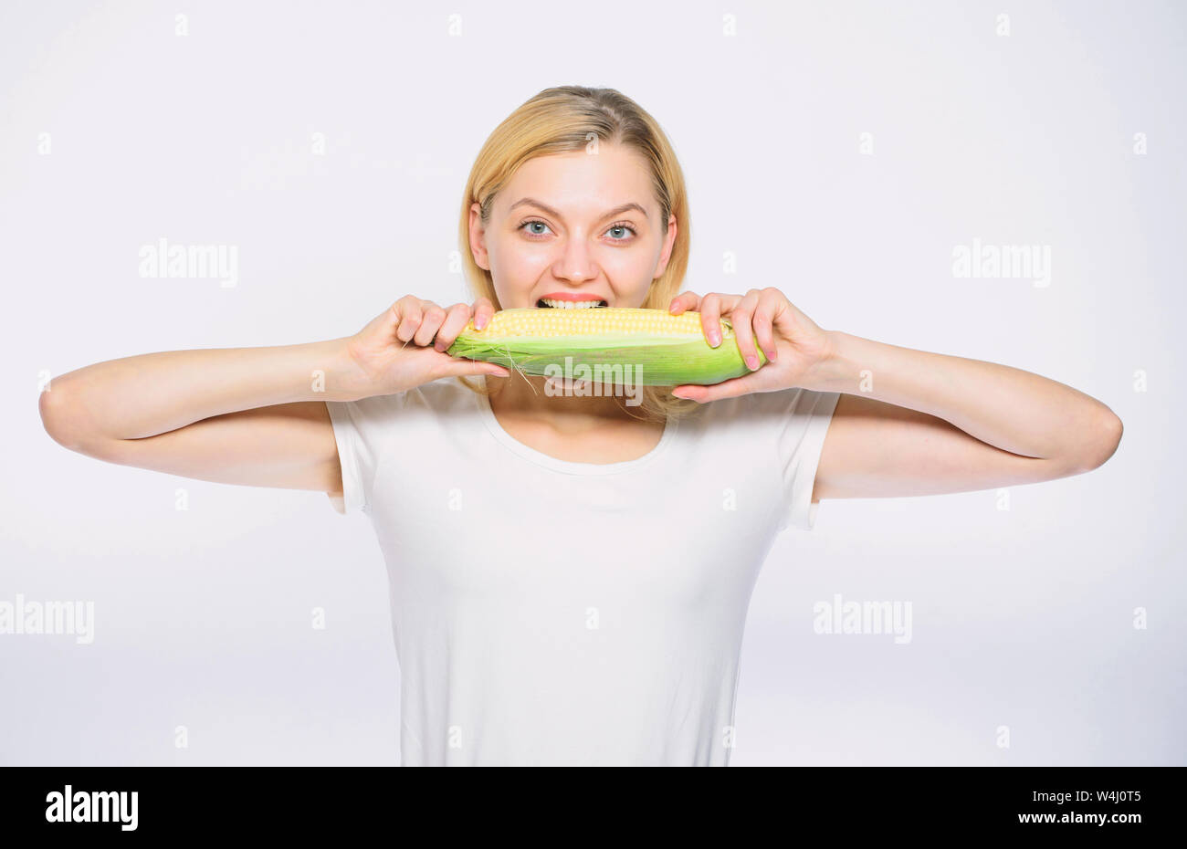 The crunch is perfect. Happy woman eating corn. vegetable harvest. corn ...
