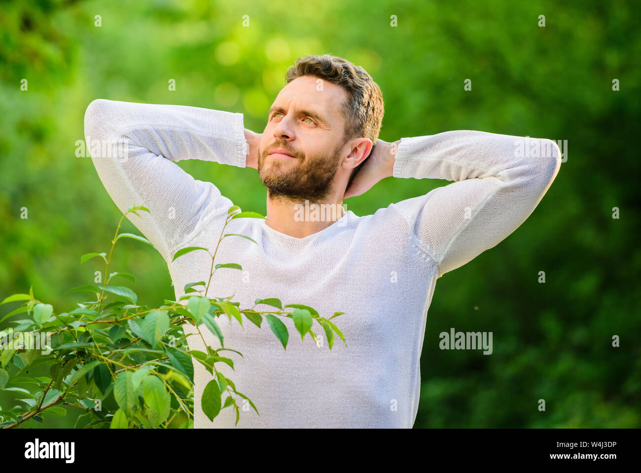 Feel power of nature. Man handsome bearded guy morning stretching ...