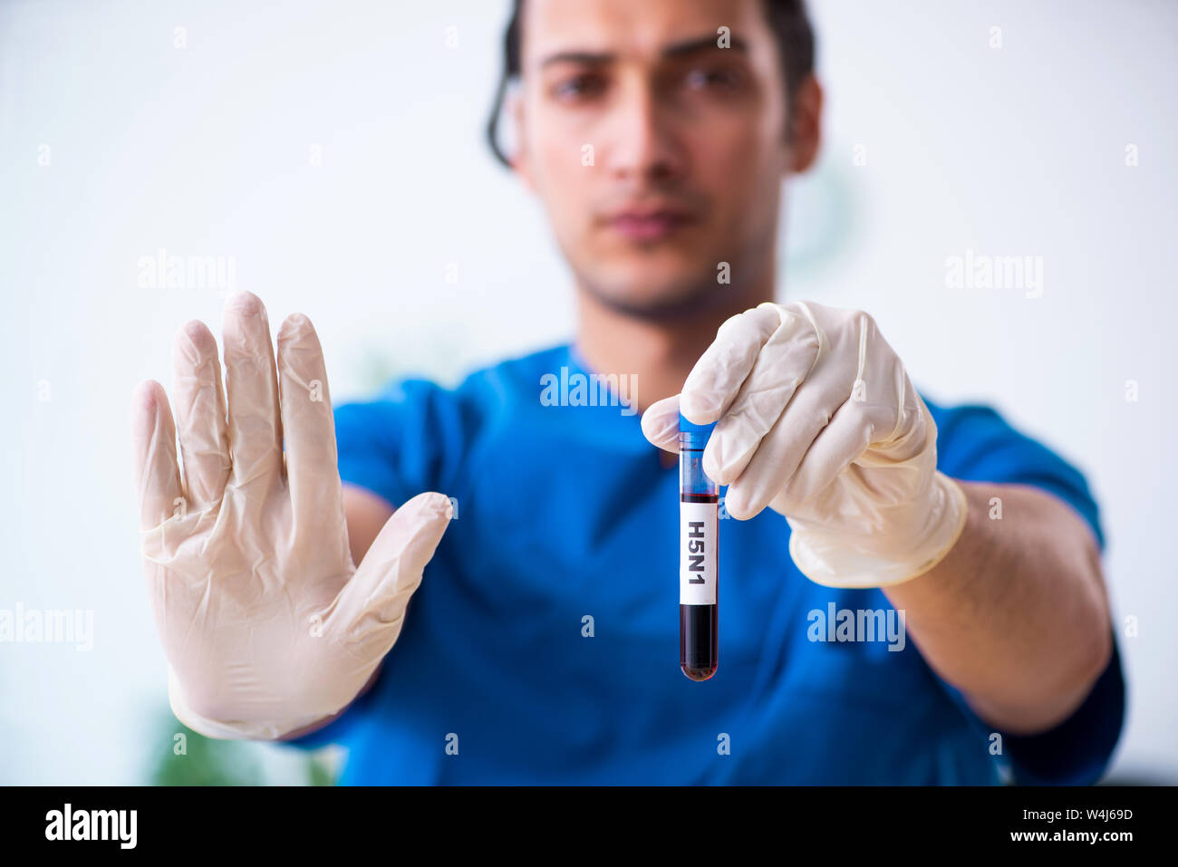 Young lab assistant testing blood samples in hospital Stock Photo - Alamy