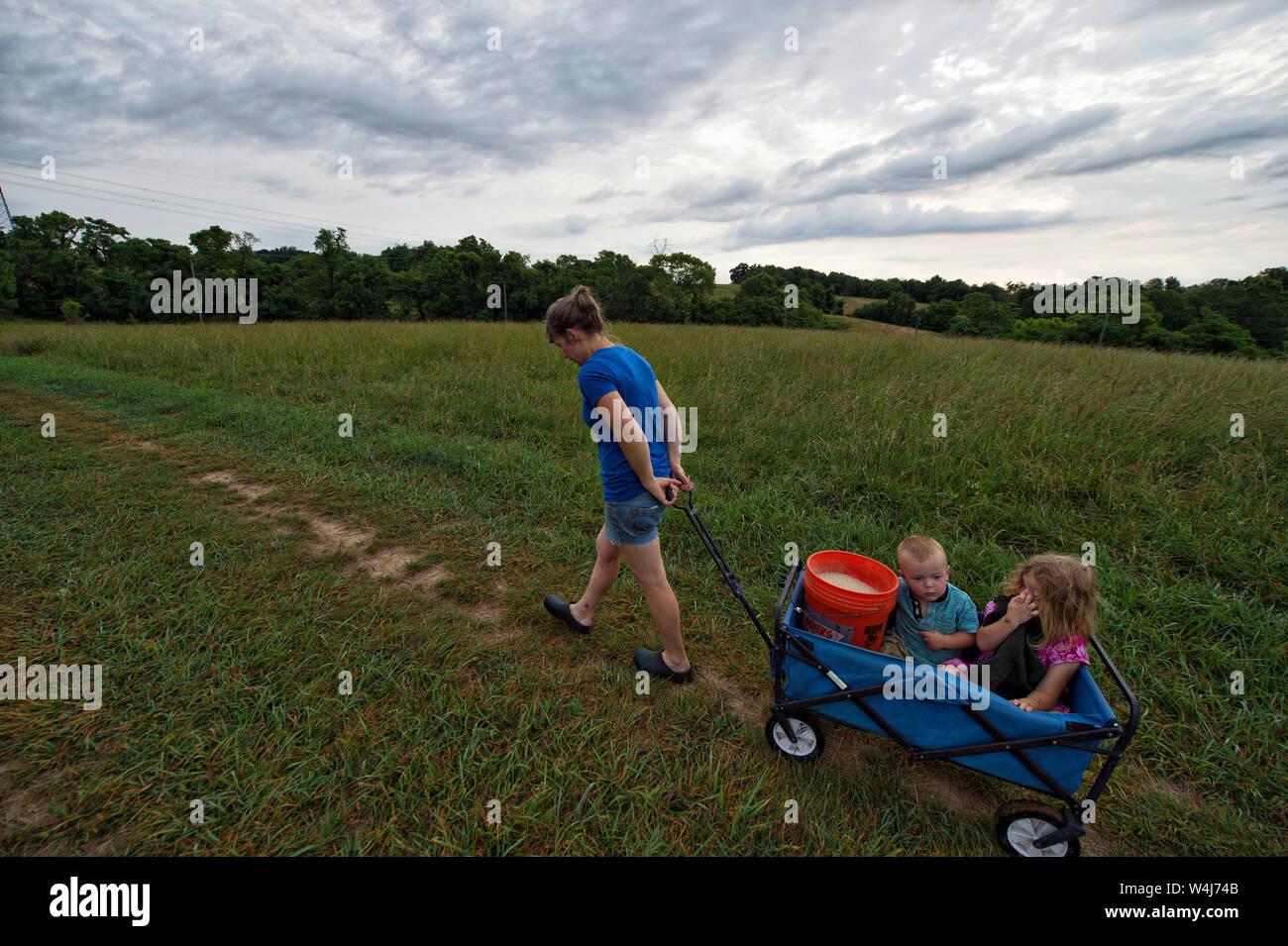 UNITED STATES - June 7, 2019: Doolan, Mabel, and Molly Kroiz head out ...