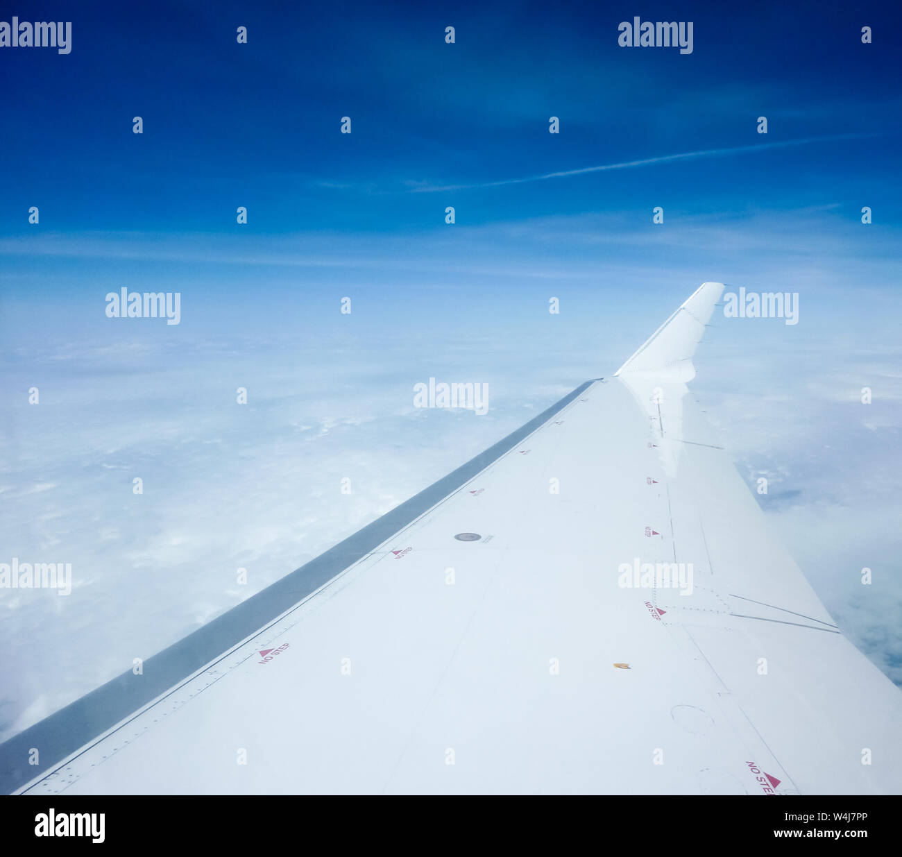 Aerial view from aircraft window with clouds Stock Photo - Alamy