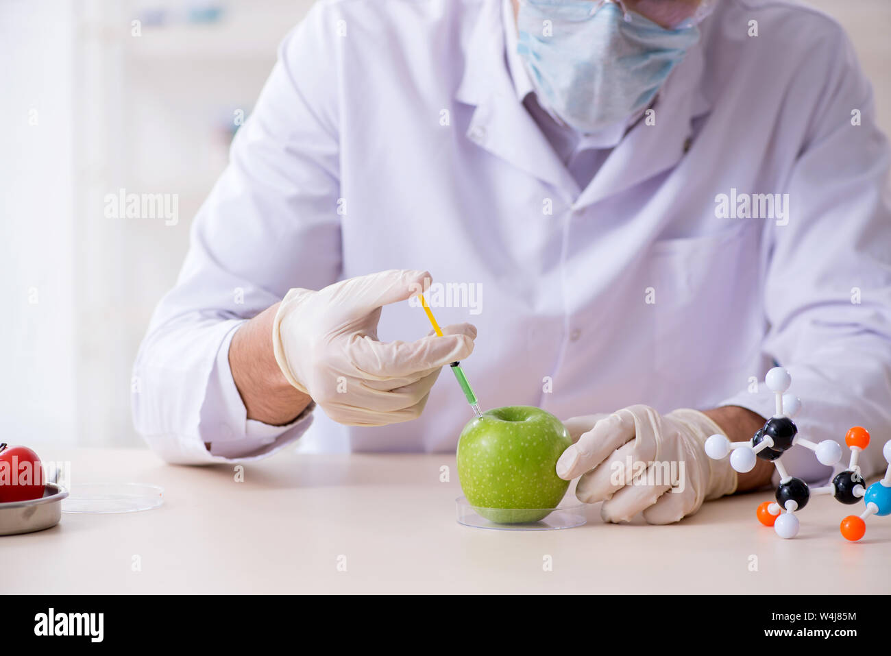 Male nutrition expert testing food products in lab Stock Photo - Alamy