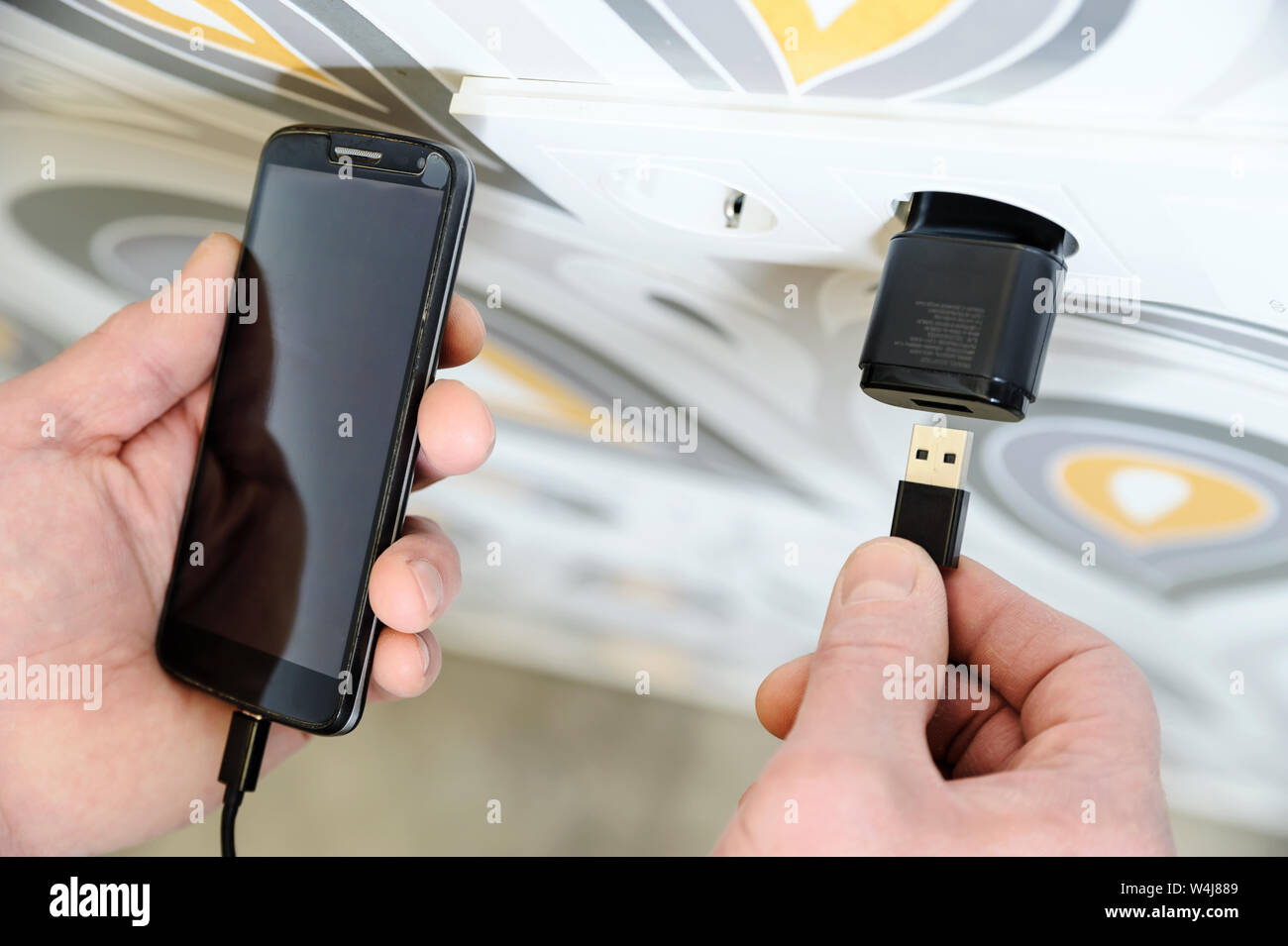 Man inserting charging port hi-res stock photography and images - Alamy