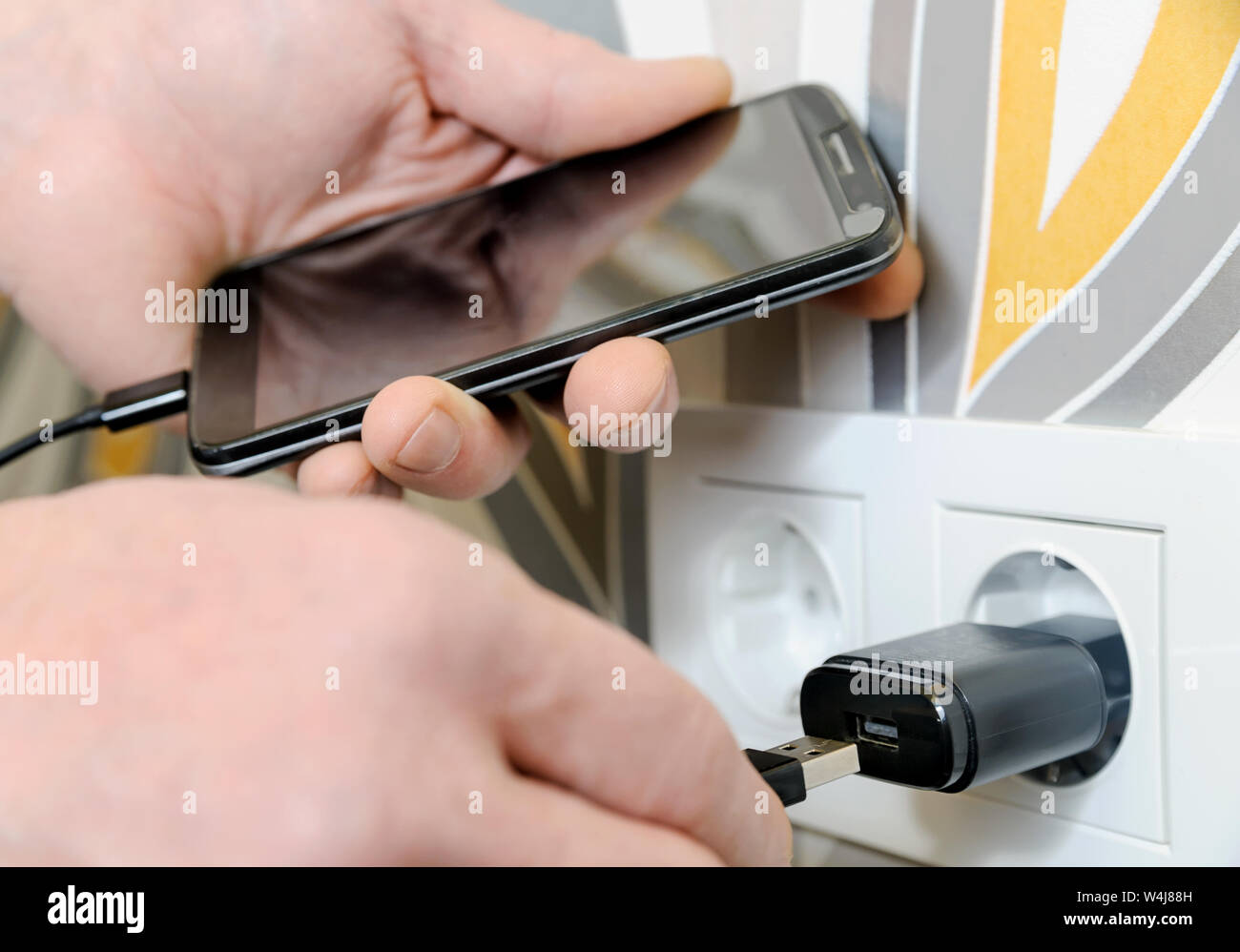 Man inserting charging port hi-res stock photography and images - Alamy