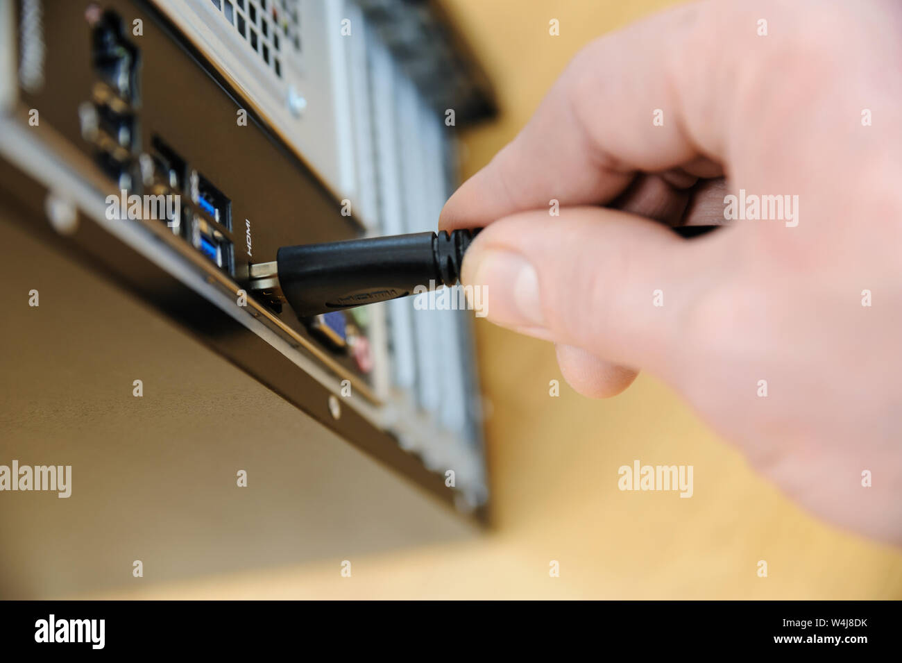 Plugging the device hi-res stock photography and images - Alamy
