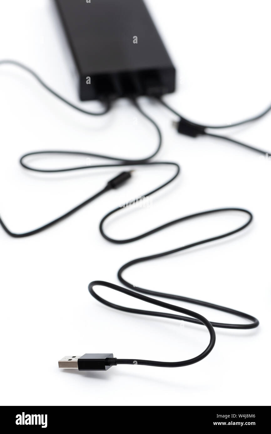 The usb cable is connected to the power bank on a white background ...