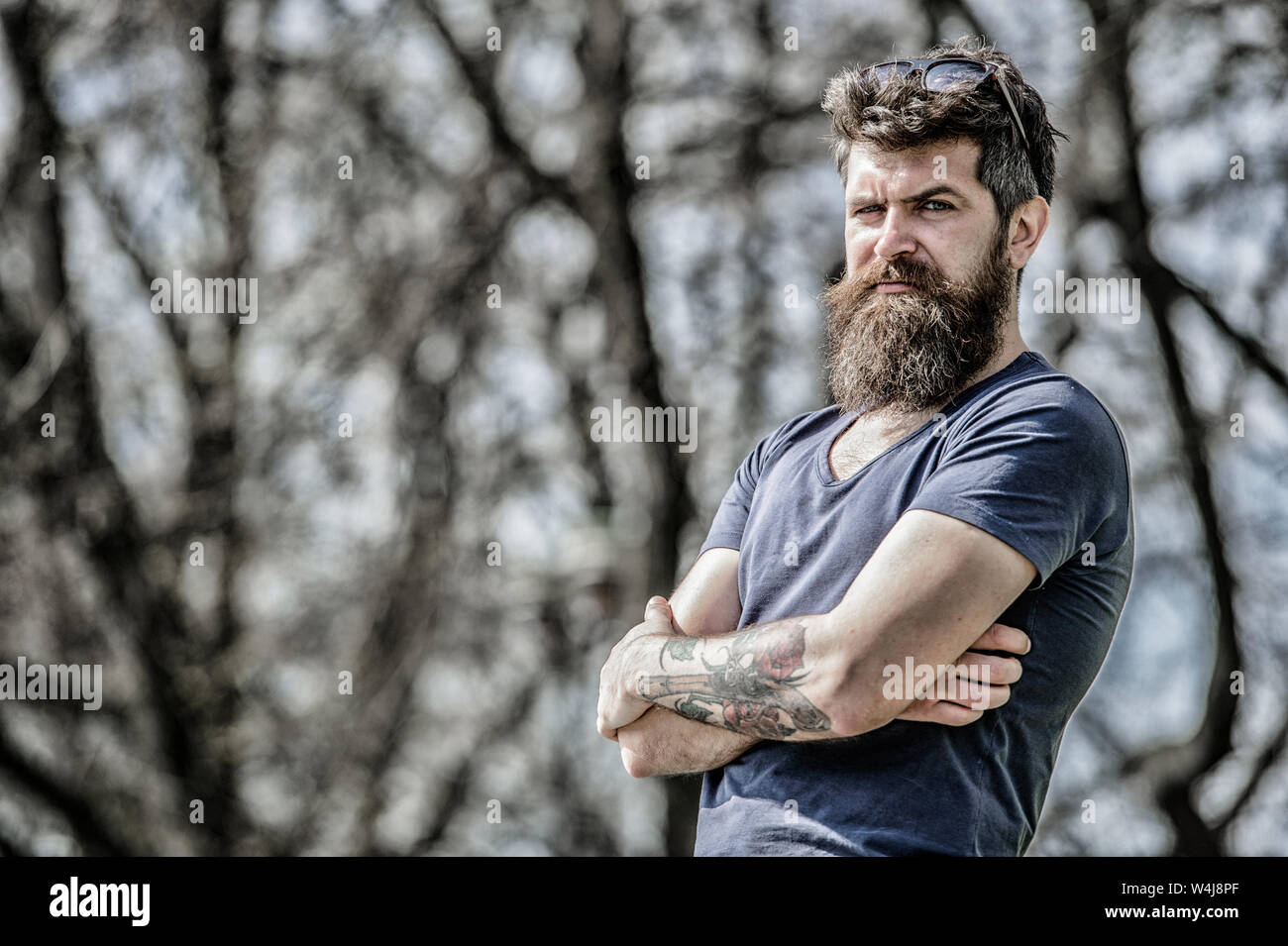 Masculinity and manliness. Man attractive bearded hipster posing ...