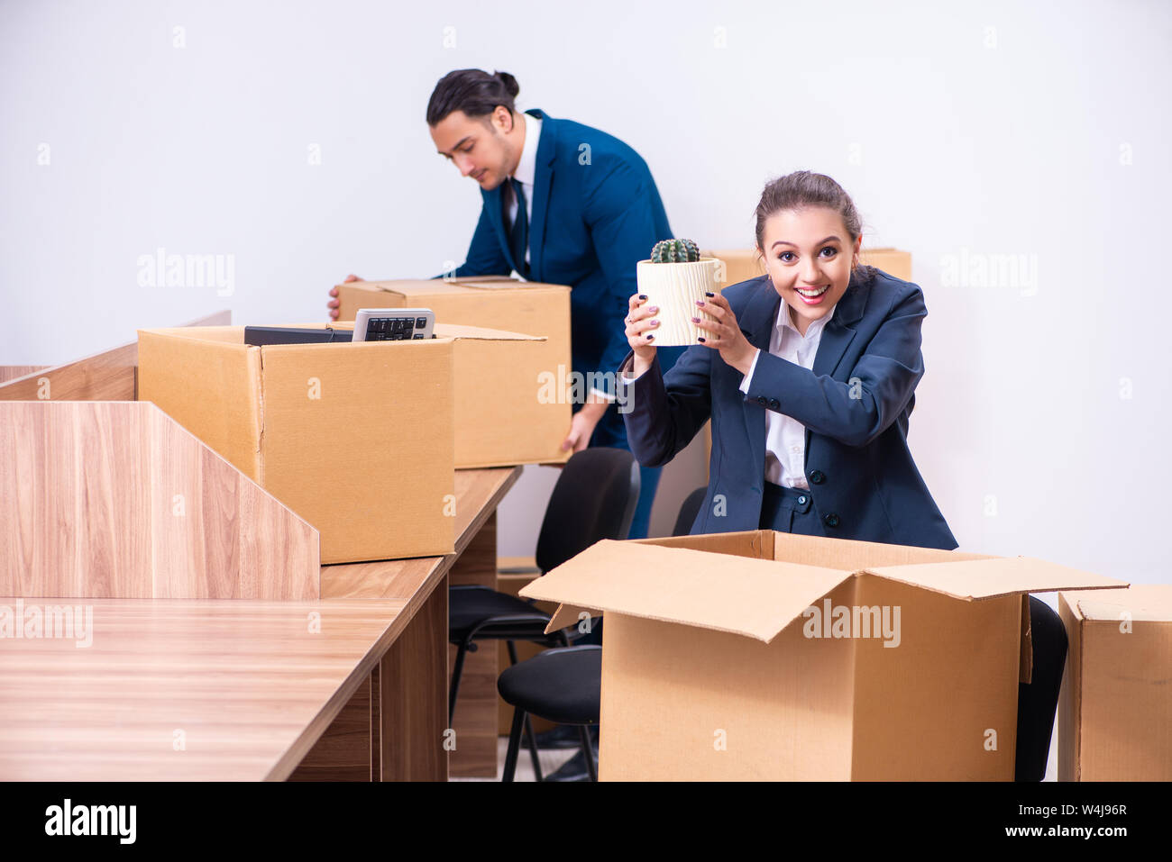 Two employees being fired from their work Stock Photo - Alamy