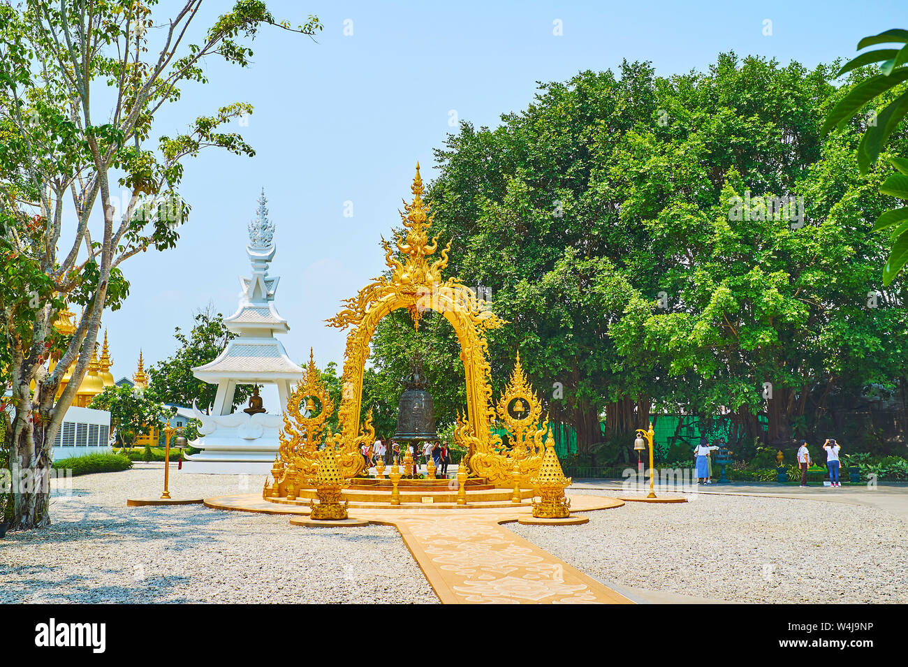 CHIANG RAI, THAILAND - MAY 9, 2019: The lacelike gilt arch with golden ...