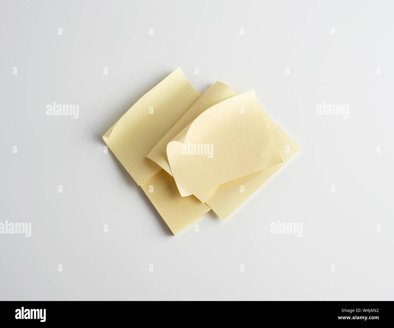 stack of yellow paper stickers on white background, close up Stock ...