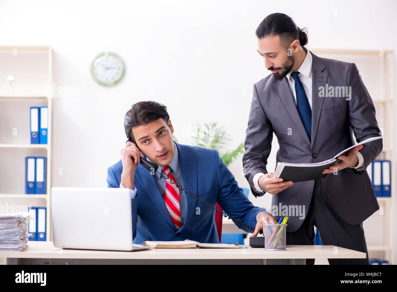 Two male colleagues in the office Stock Photo - Alamy