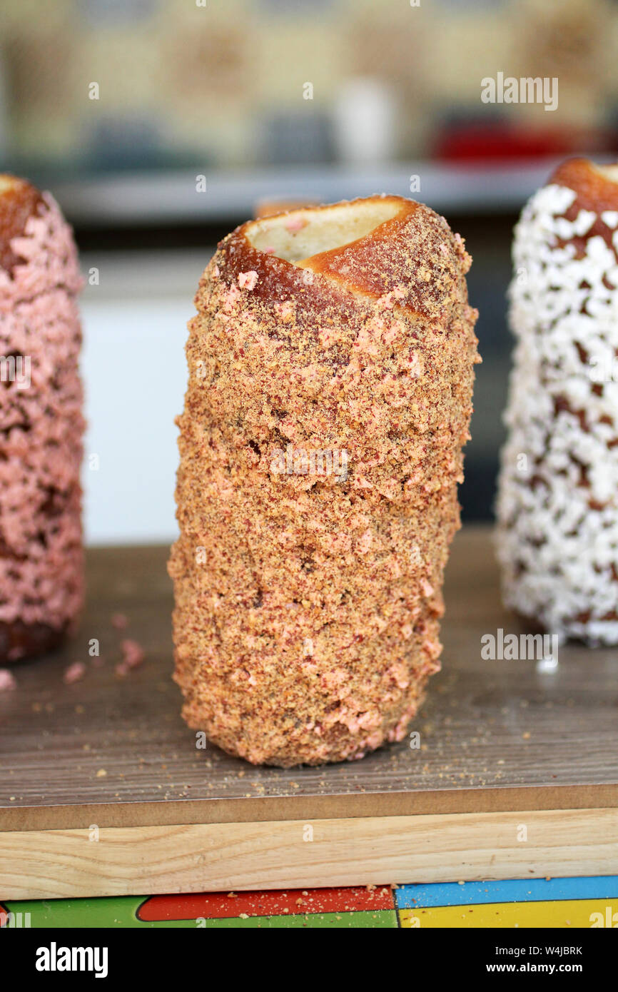 Traditional Hungarian roll kurtosh with ground nuts on a counter in a ...