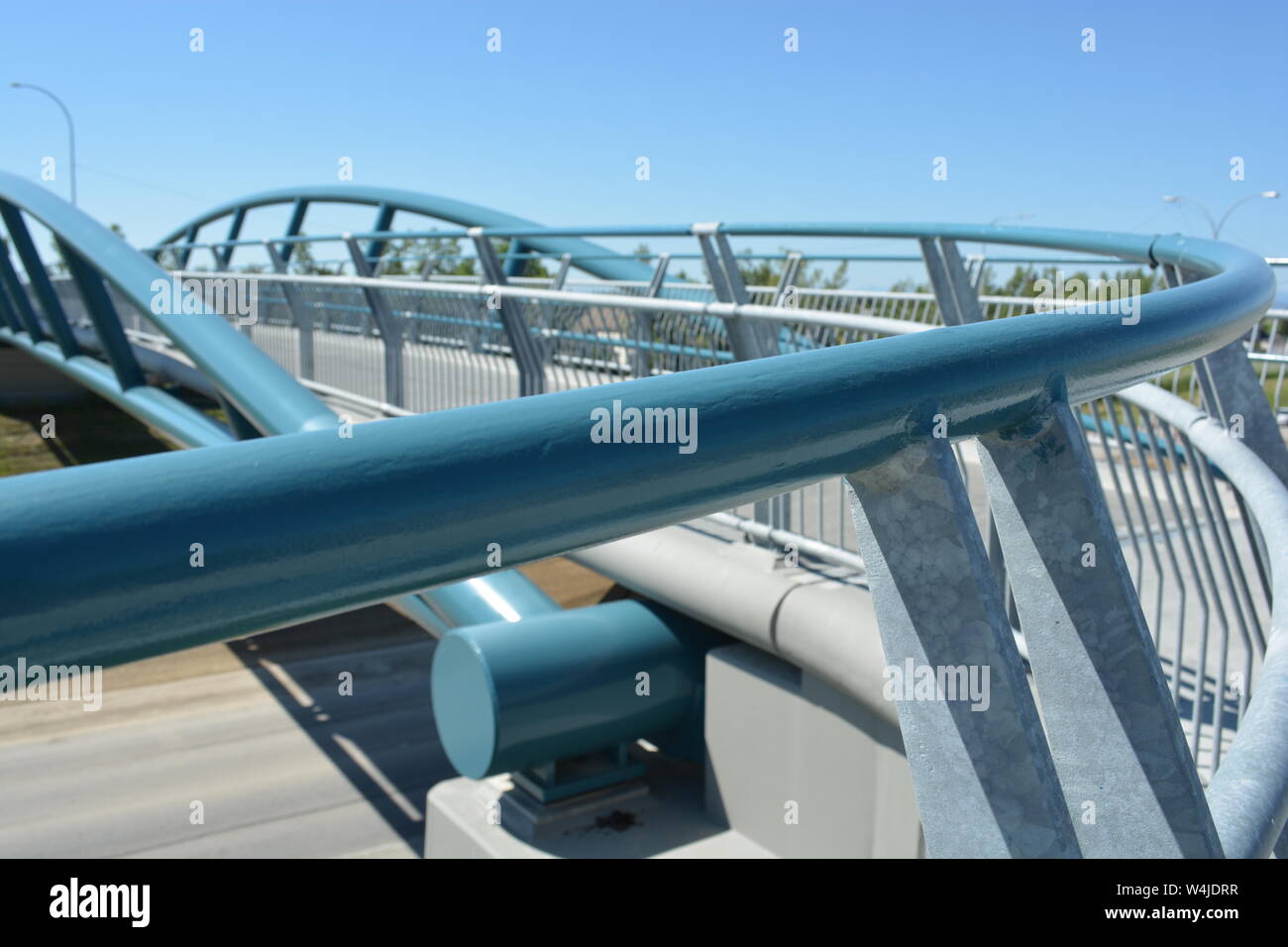 Handrail of pedestrian bridge over highway Stock Photo - Alamy