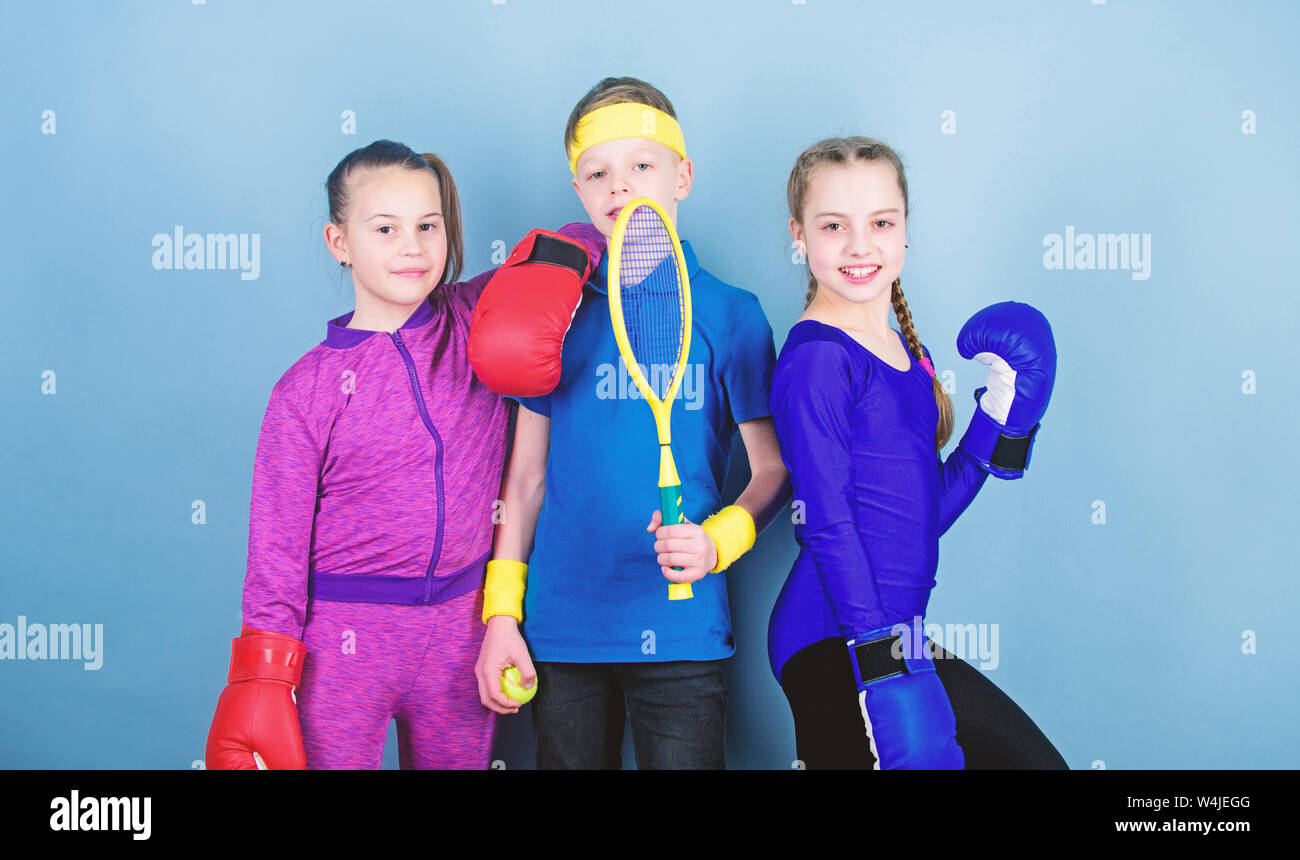 Born to fight. Happy children in boxing gloves with tennis racket and ...