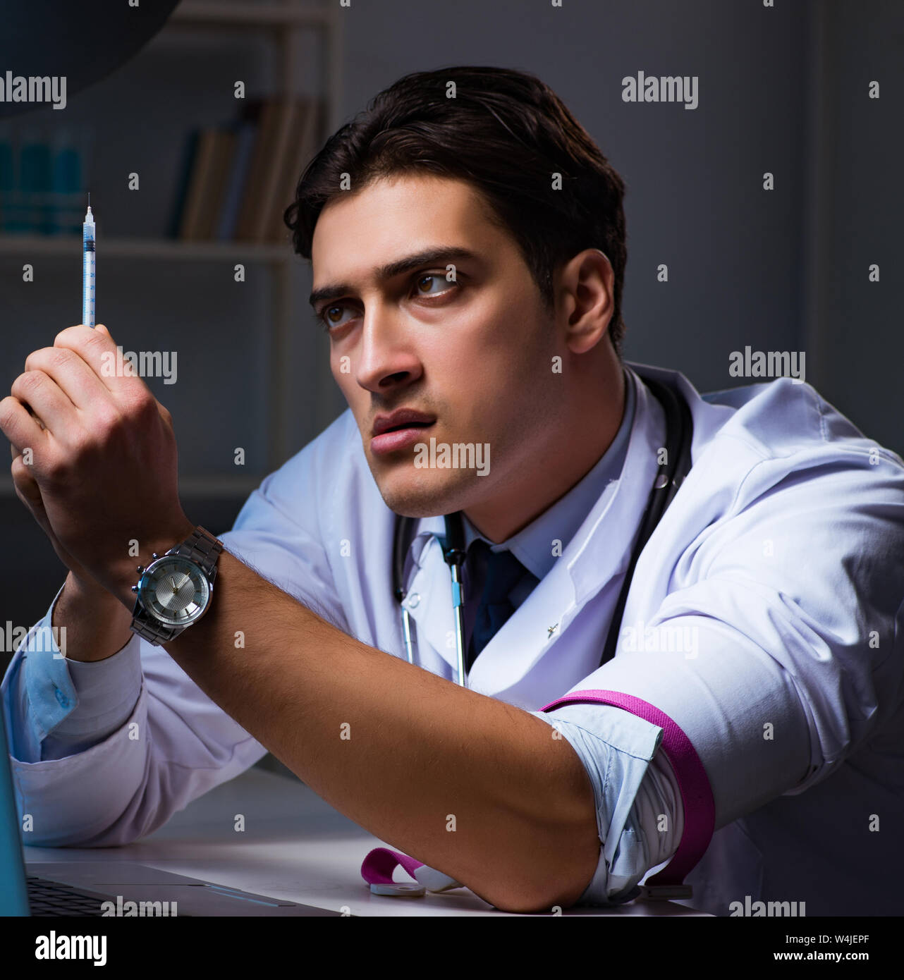 Doctor drug addict staying late on hospital Stock Photo - Alamy