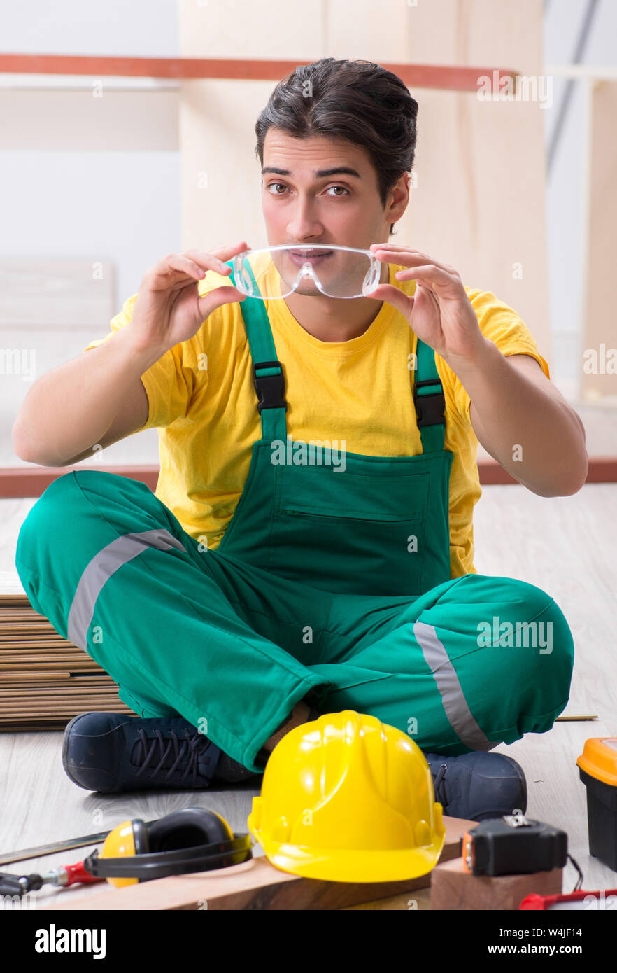 Worker wearing protective goggles at construction site Stock Photo - Alamy