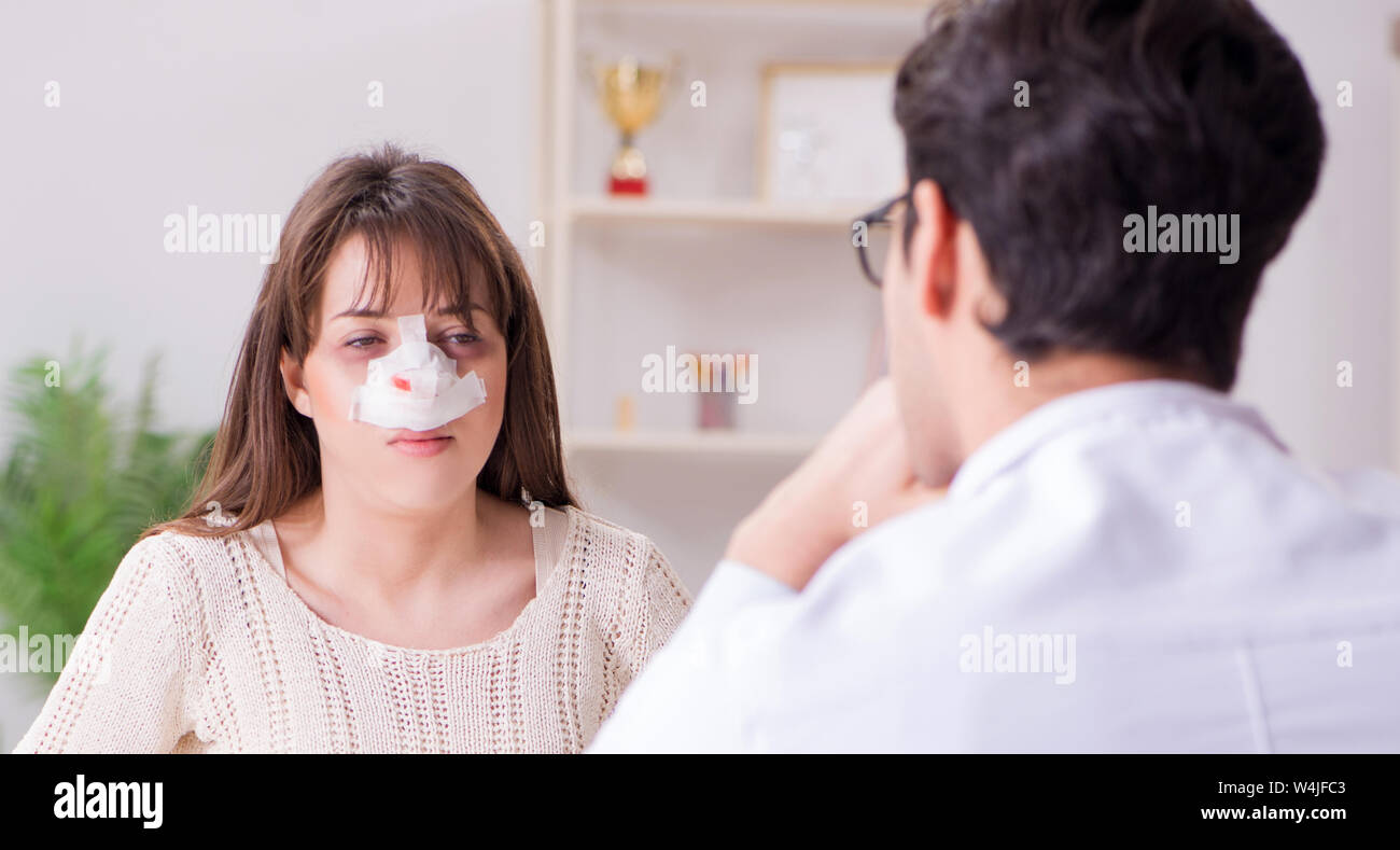 Male doctor talking to patient with nose operation surgery Stock Photo ...