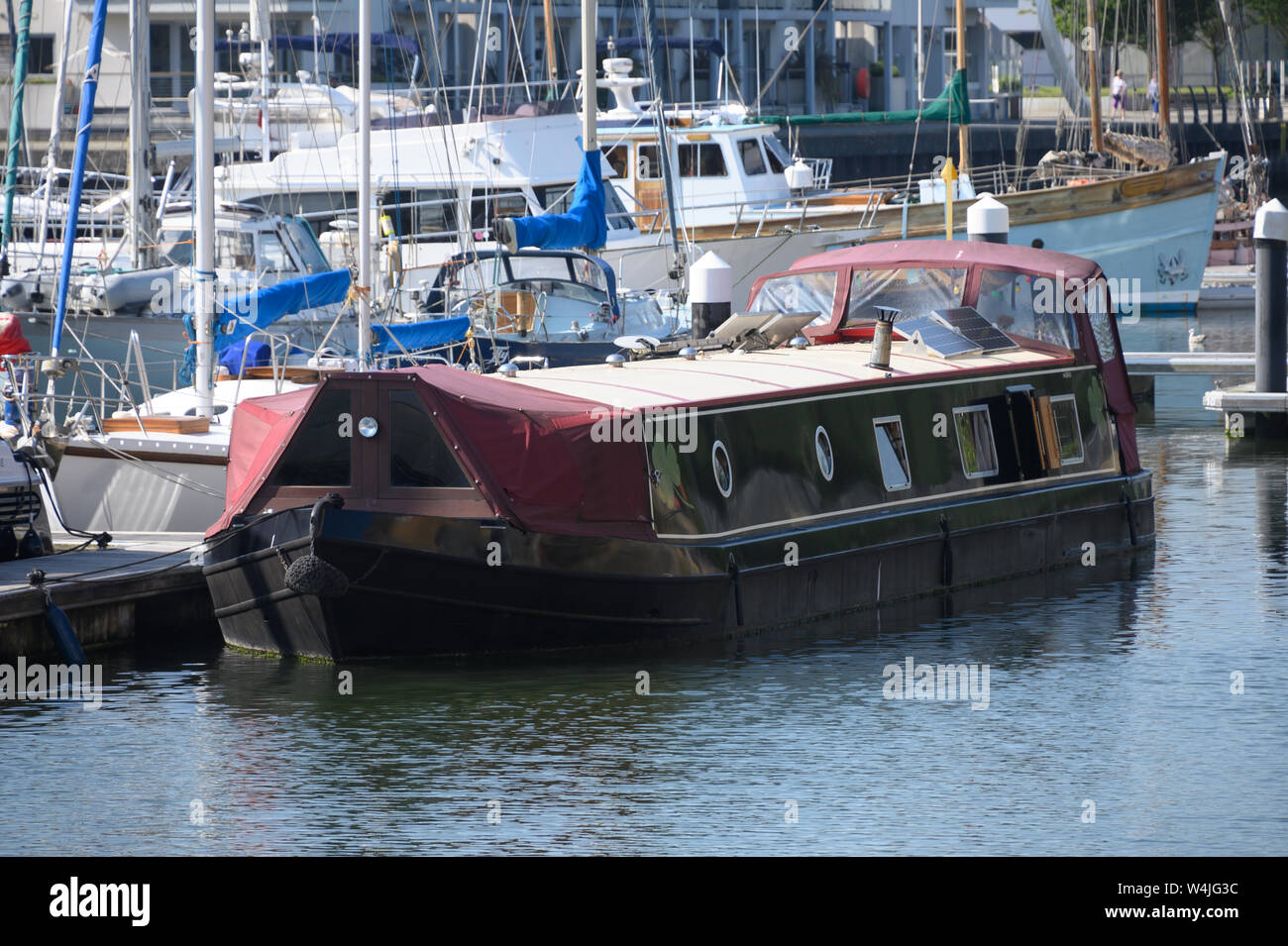 A narrow boat moored to a marina pontoon Stock Photo - Alamy