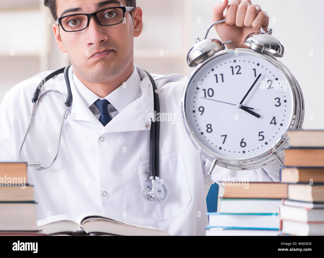Medical student running out of time for exams Stock Photo - Alamy