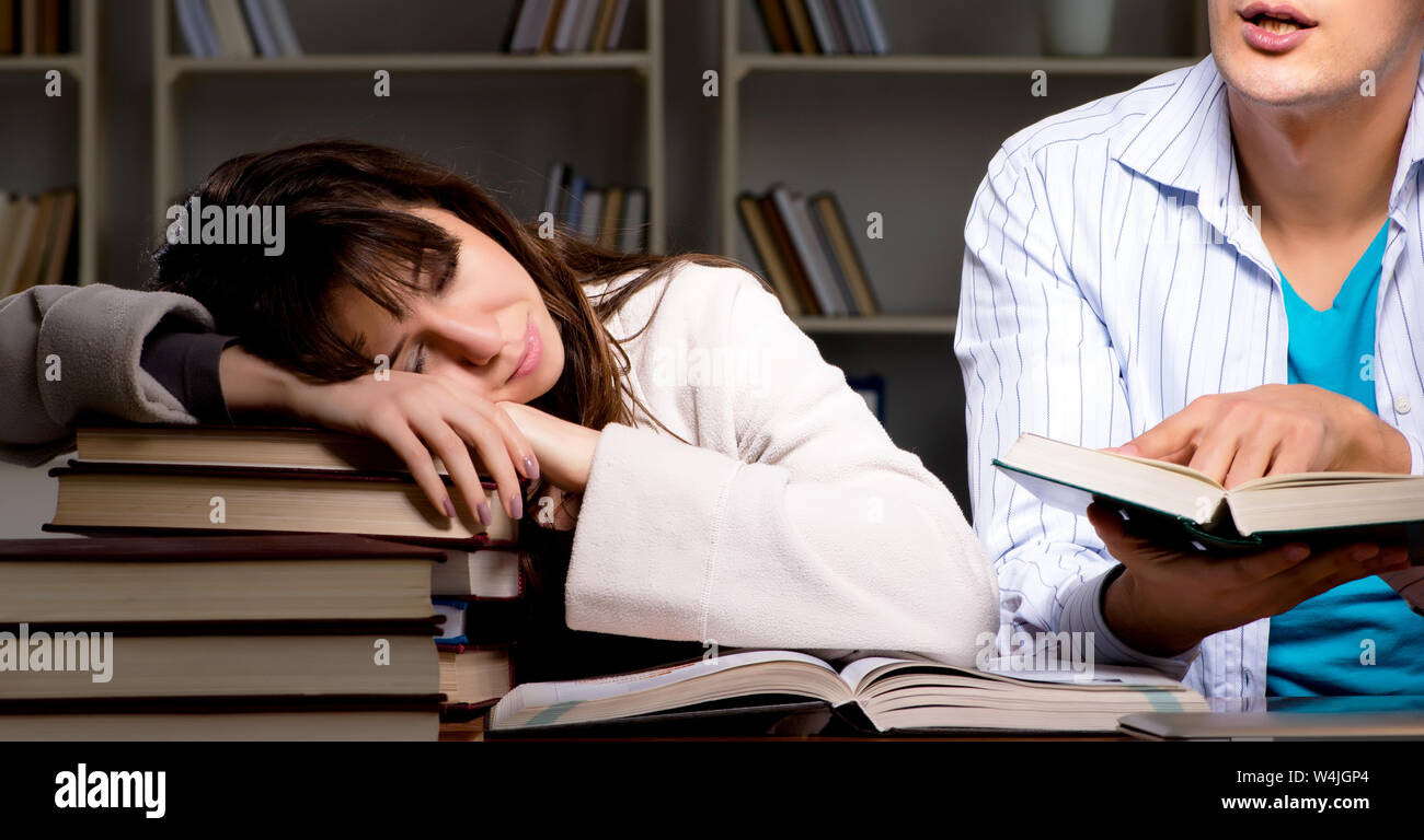 Two students studying late preparing for exams Stock Photo - Alamy