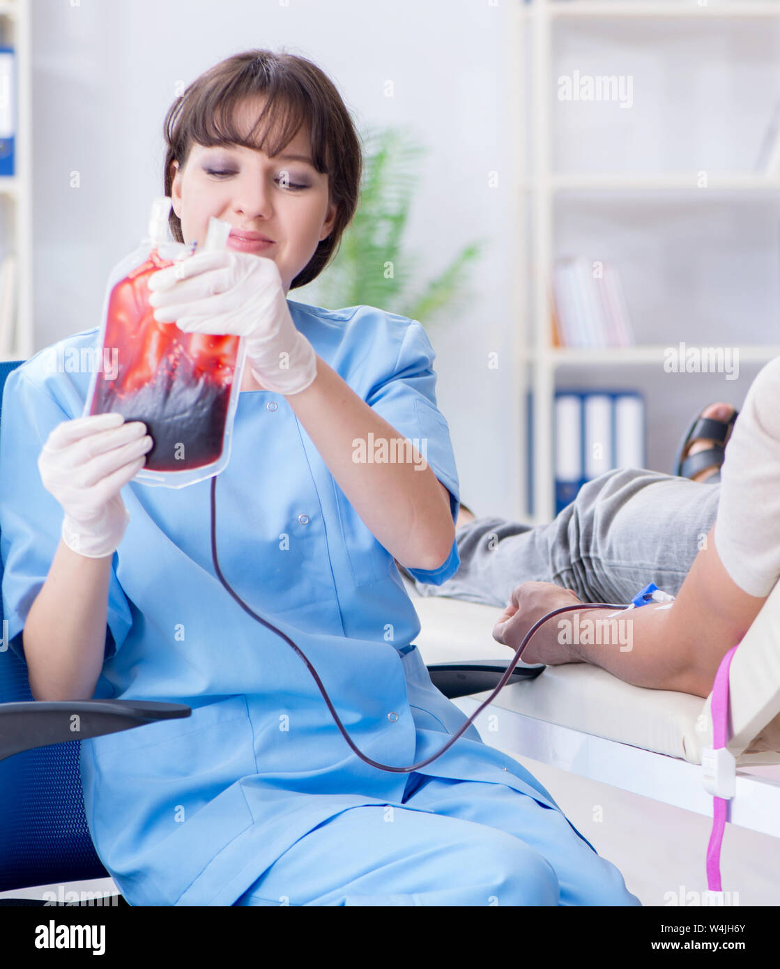 Patient getting blood transfusion in hospital clinic Stock Photo - Alamy