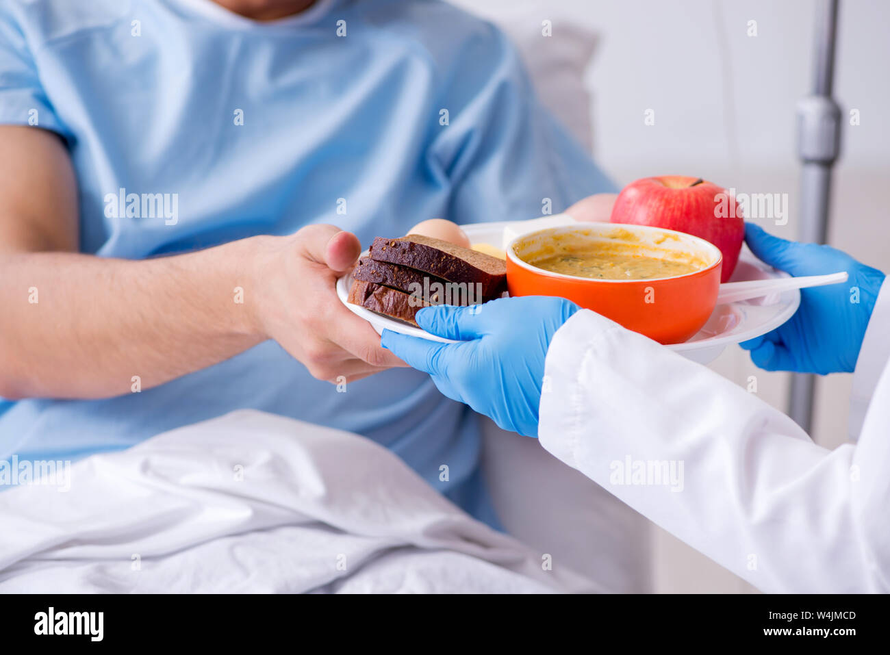 Male patient eating food in the hospital Stock Photo - Alamy