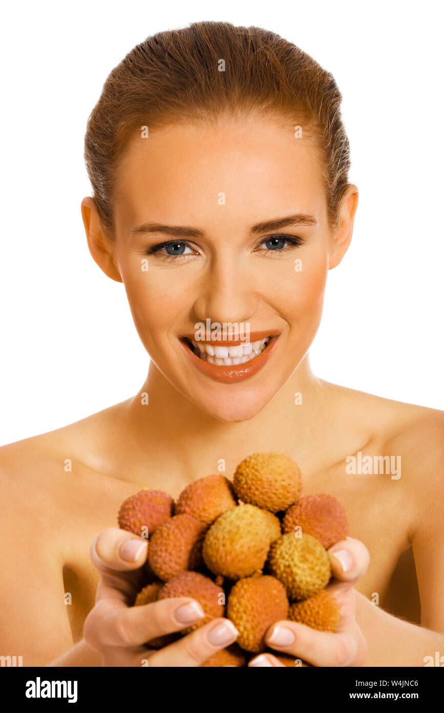 Woman holding chinese lychee fruits in hands. Isolated on white ...