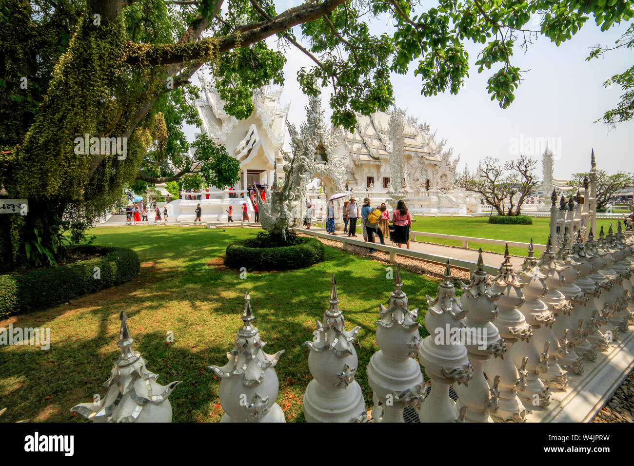 Wat Rong Khun, White Temple, shade trees leading to the main entrance ...
