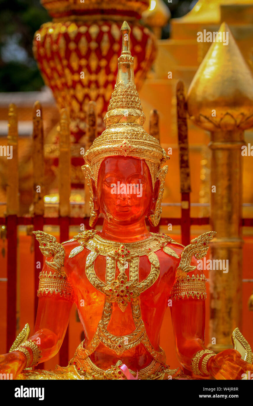 Impressive red crystal statue of Buddha draped in gold sits at the Wat ...