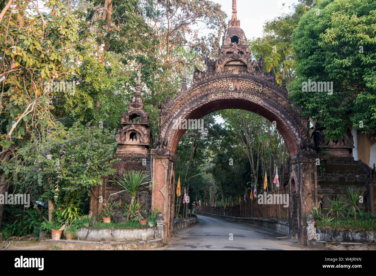 The gate at the Wat Phra That Chom Chaeng Temple near the city of Phrae ...