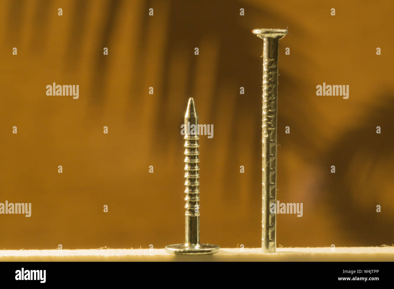 Small metal nails isolated background Stock Photo - Alamy